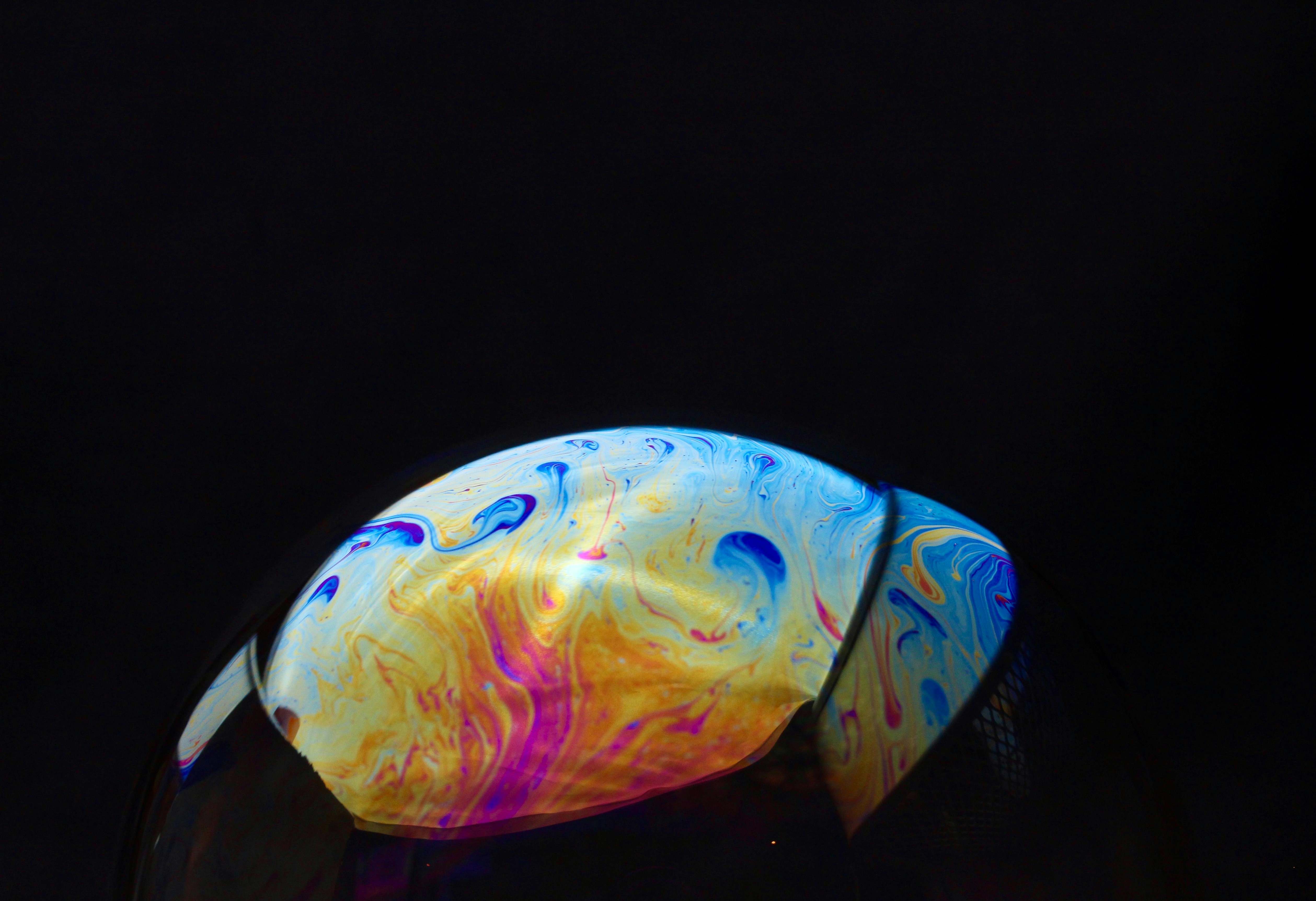 Liquid Candy: Swirls of Color on a Dark Backdrop