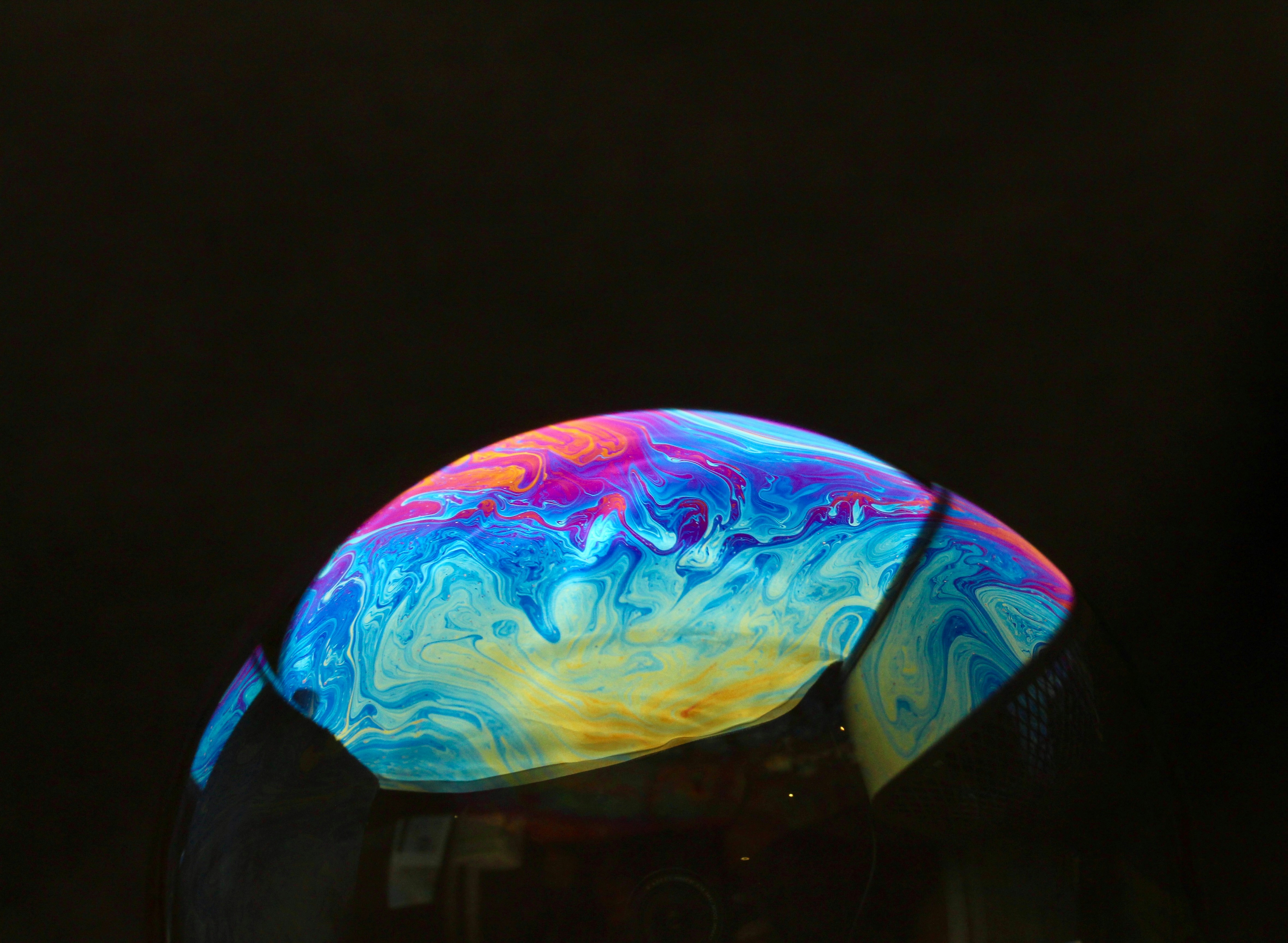 Chromatic Orb: Swirling Alchemy on a Glass Lens