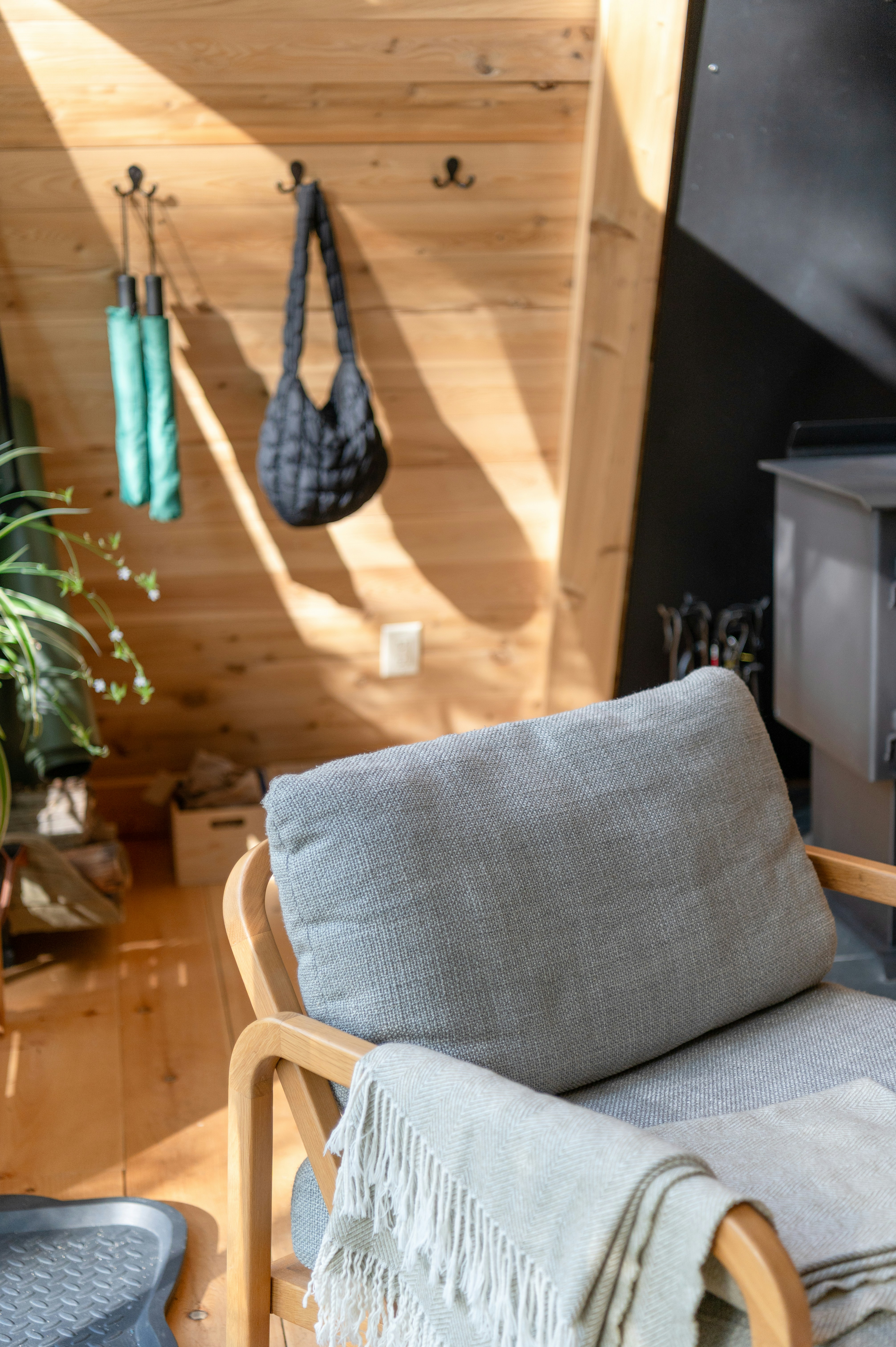 Cozy Corner: A Sunlit Lounge with Hanging Gear