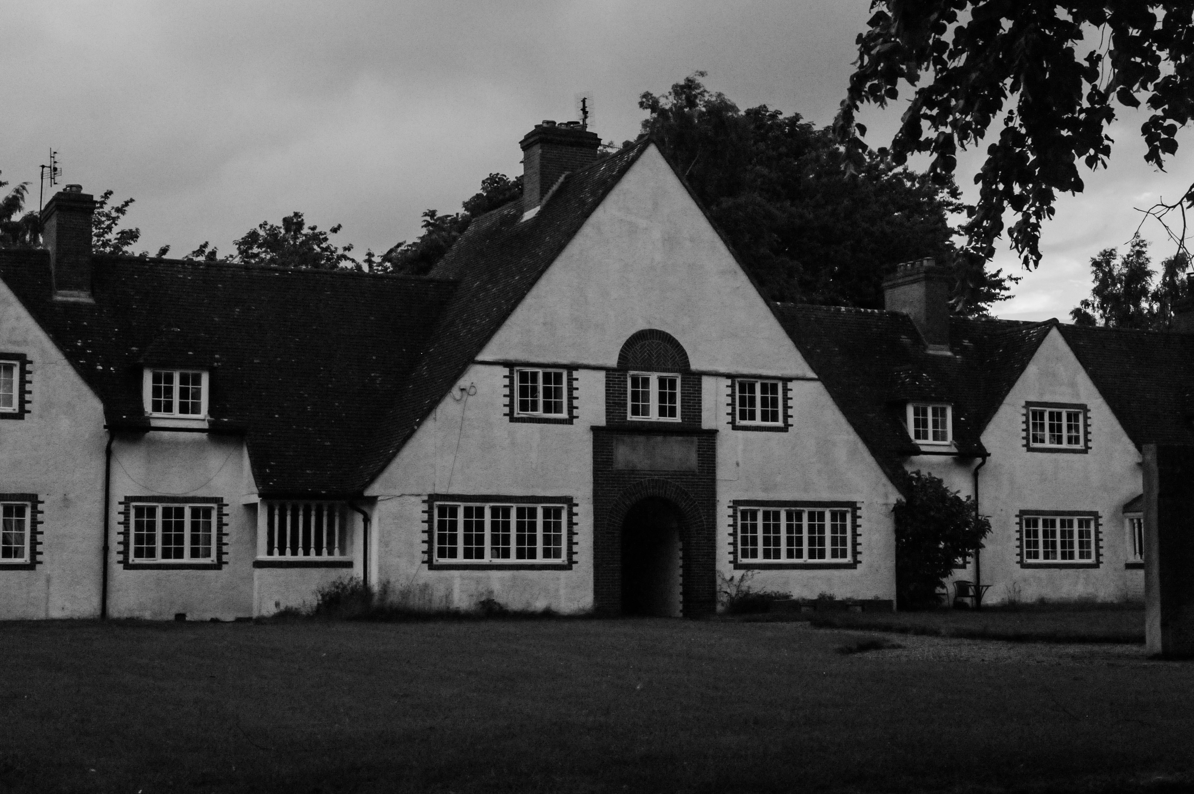 Greyed Grand House Under Clouded Sky