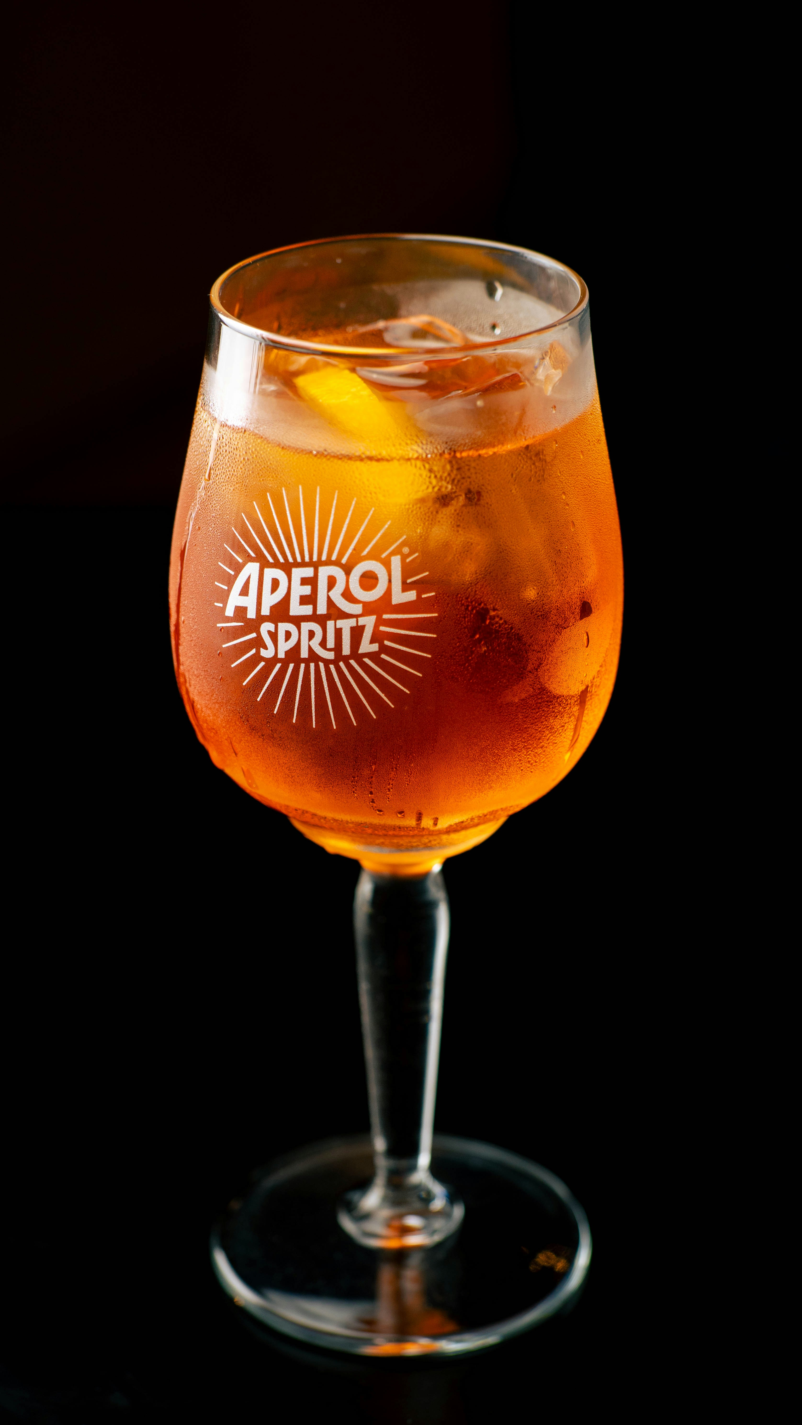Aperol Glow: Orange Elixir in a Crystal Glass