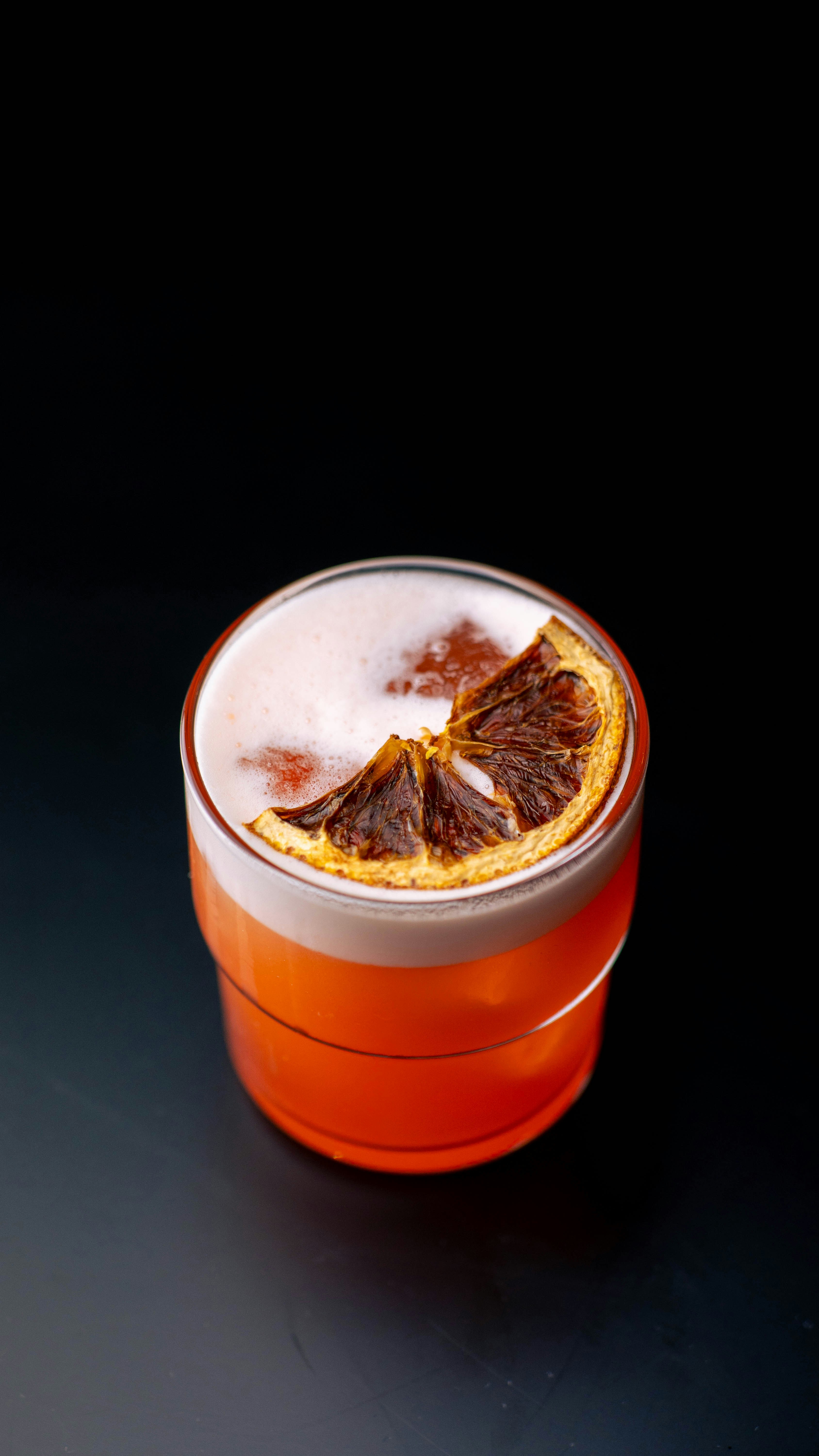Citrus Ember: a crystalline cocktail under moody light