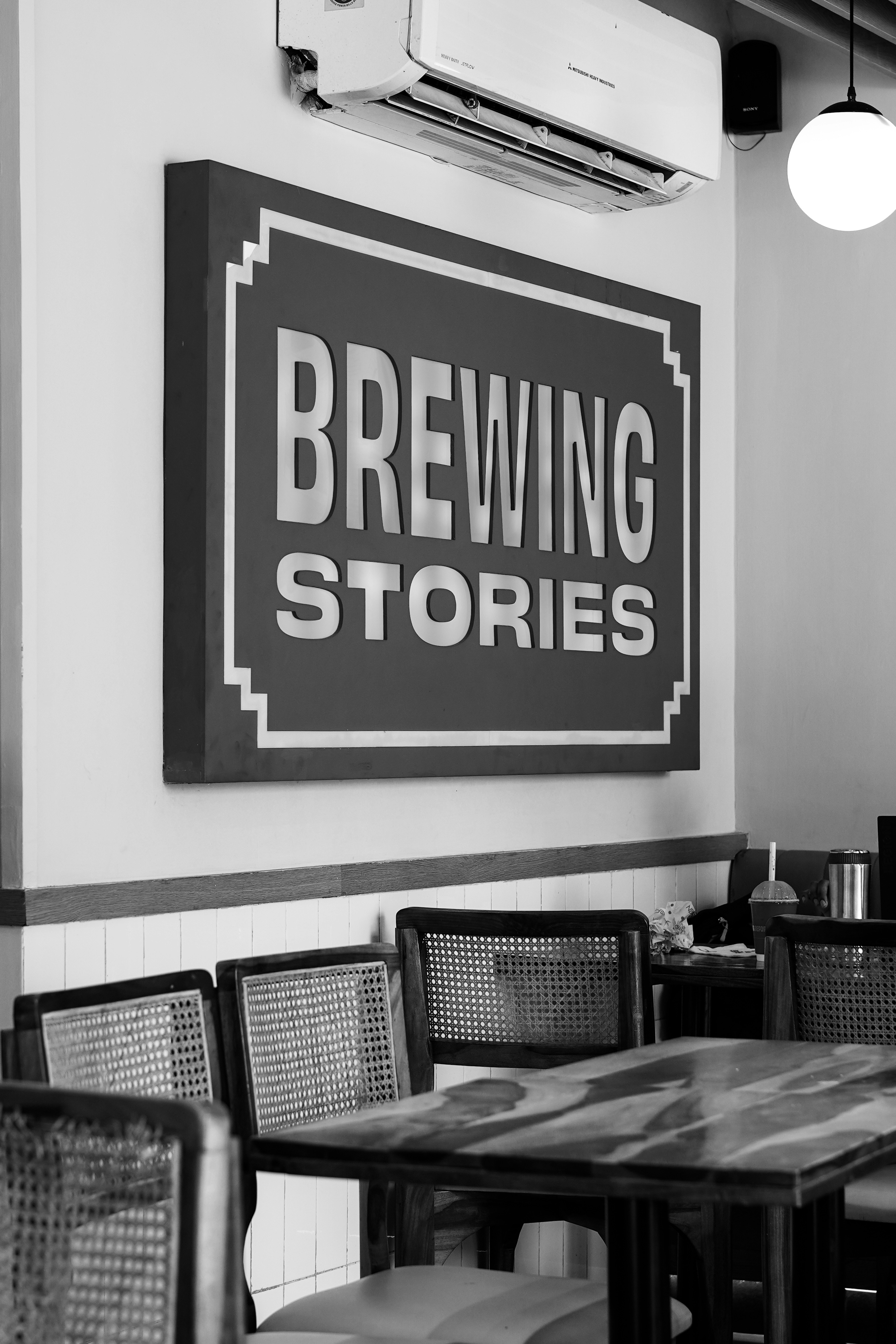Brewing Stories: A Quiet Café Corner with Monochrome Signage