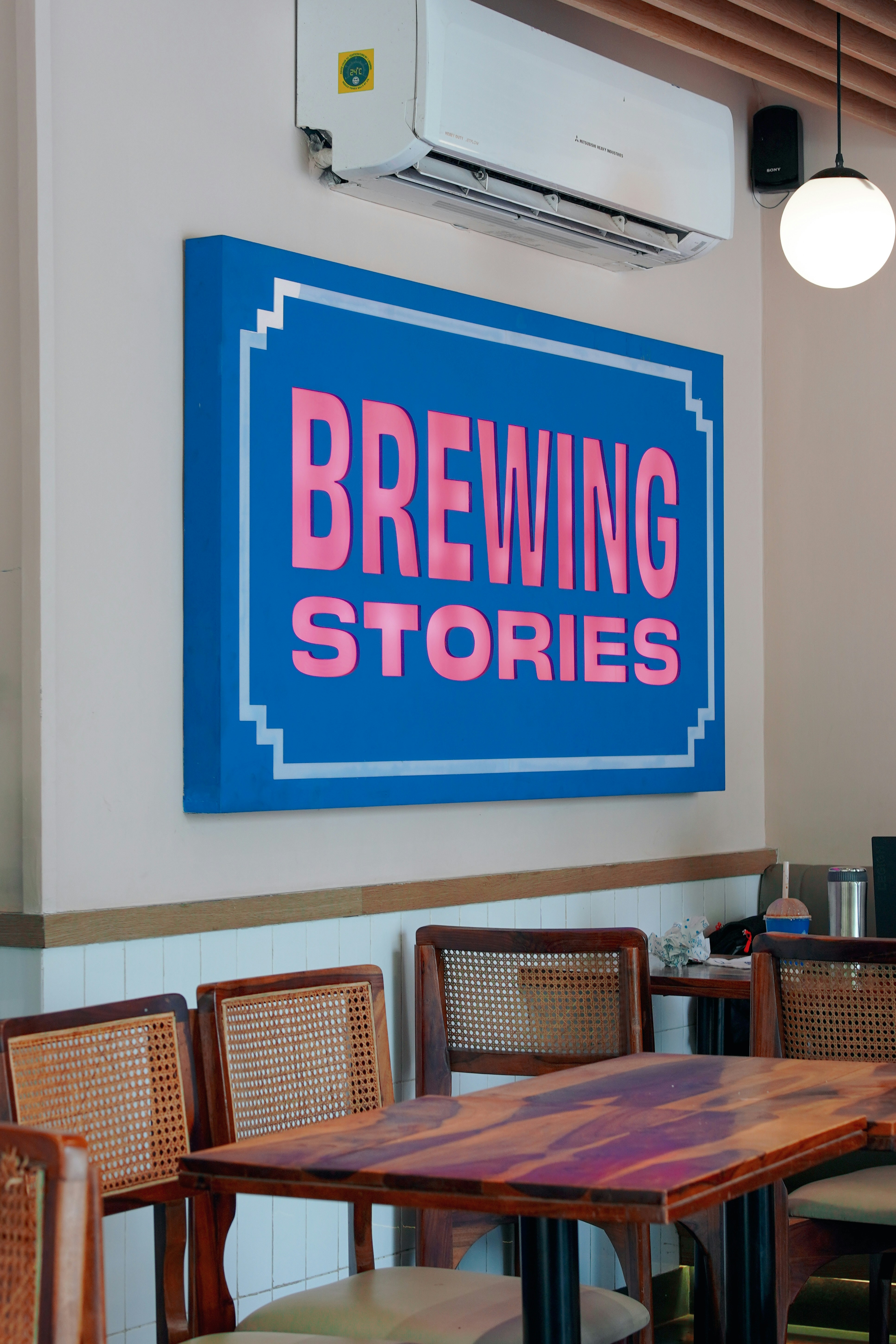 Brewing Stories: A Bright Sign Stares Down the Cozy Café