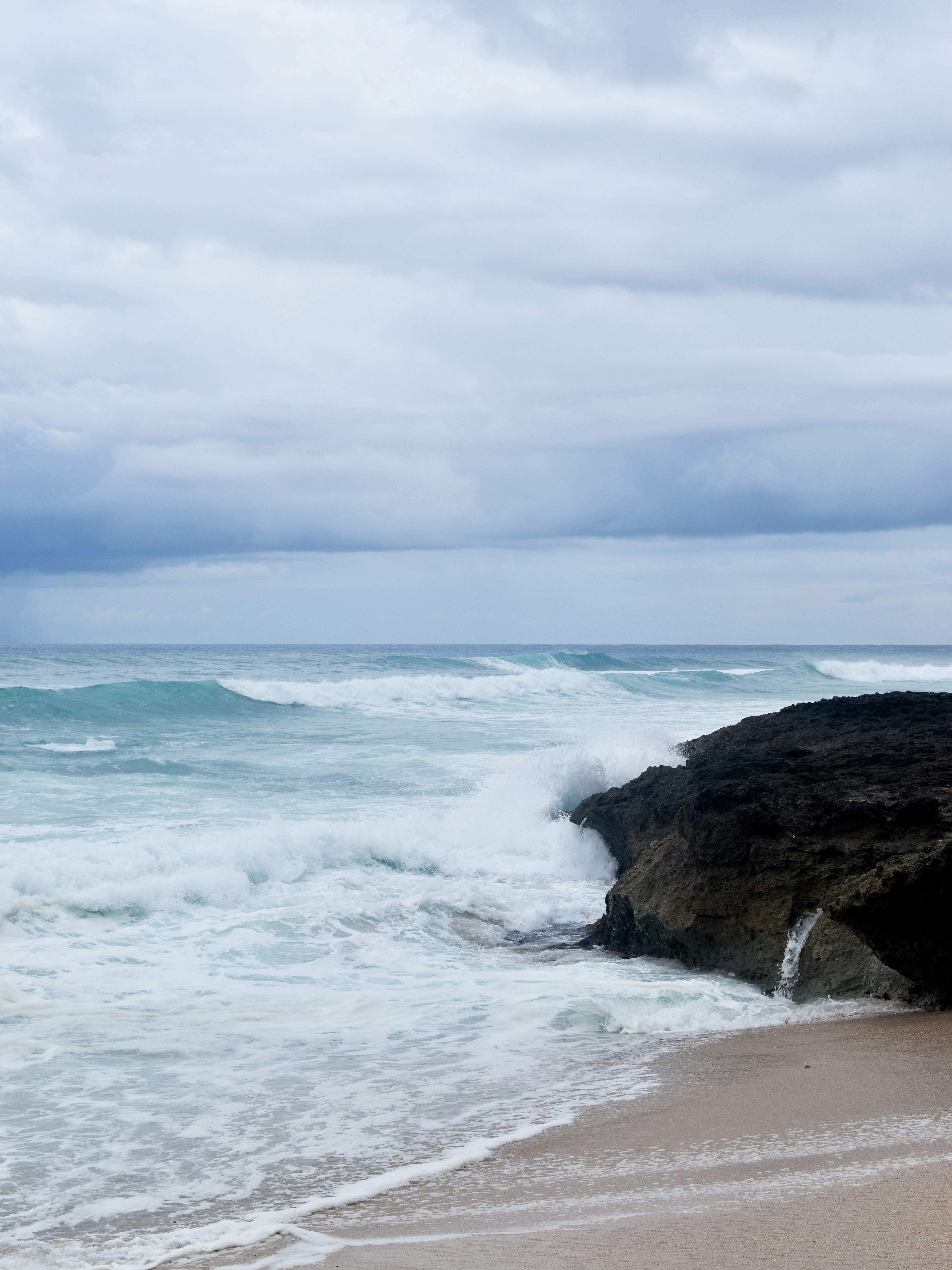 Tide Meets Tidepool: A Quiet Shore by Rock and Foam