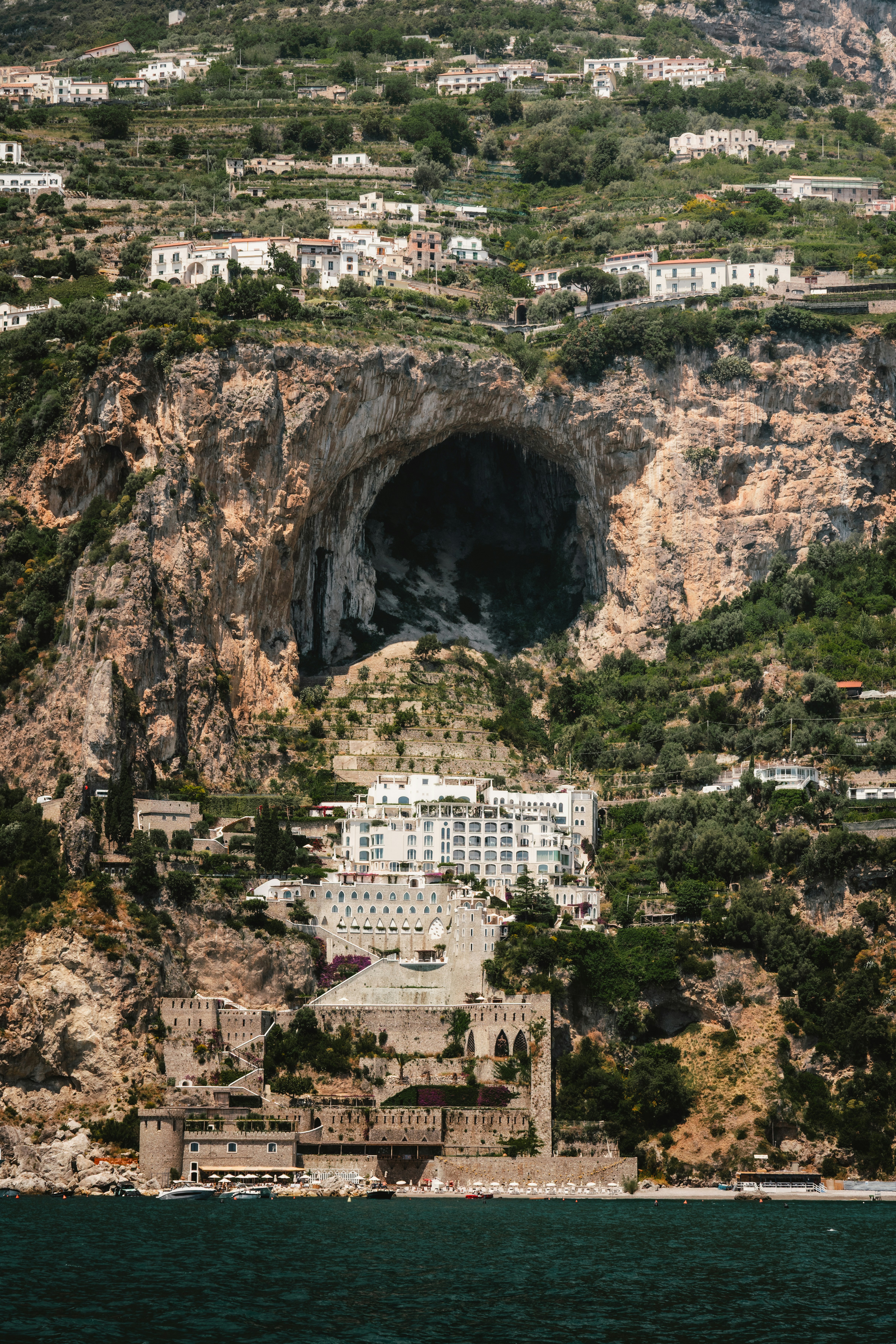 Coastal Village Nestled at the Gate of a Sunken Cave