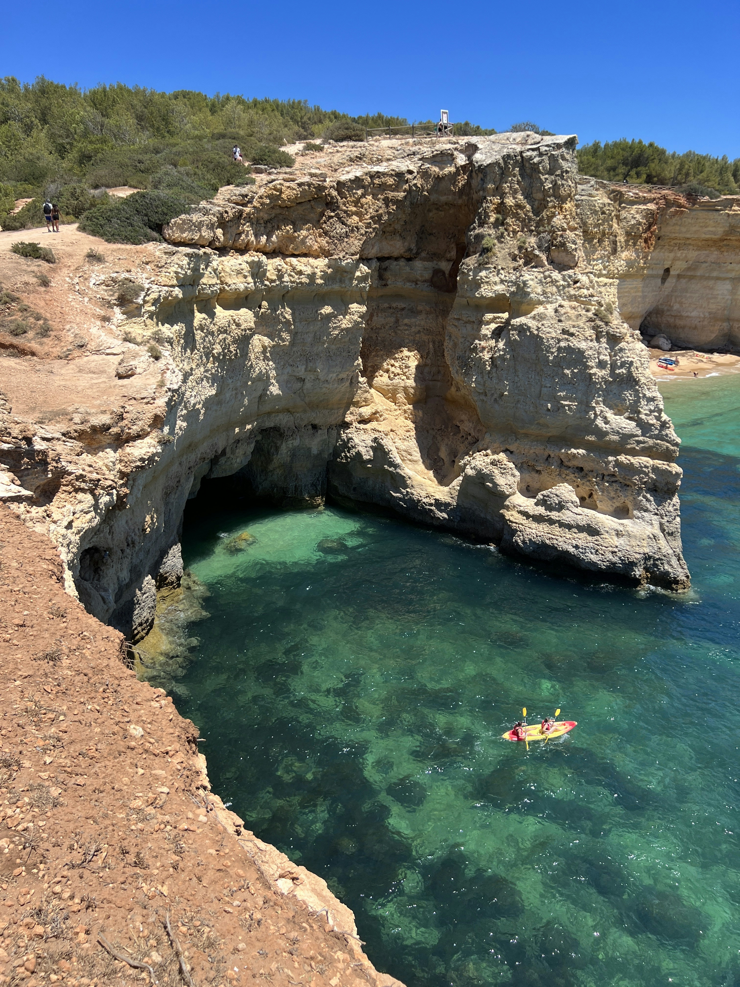Sea-cave Cathedral: Emerald Waters and Cliff Portrait