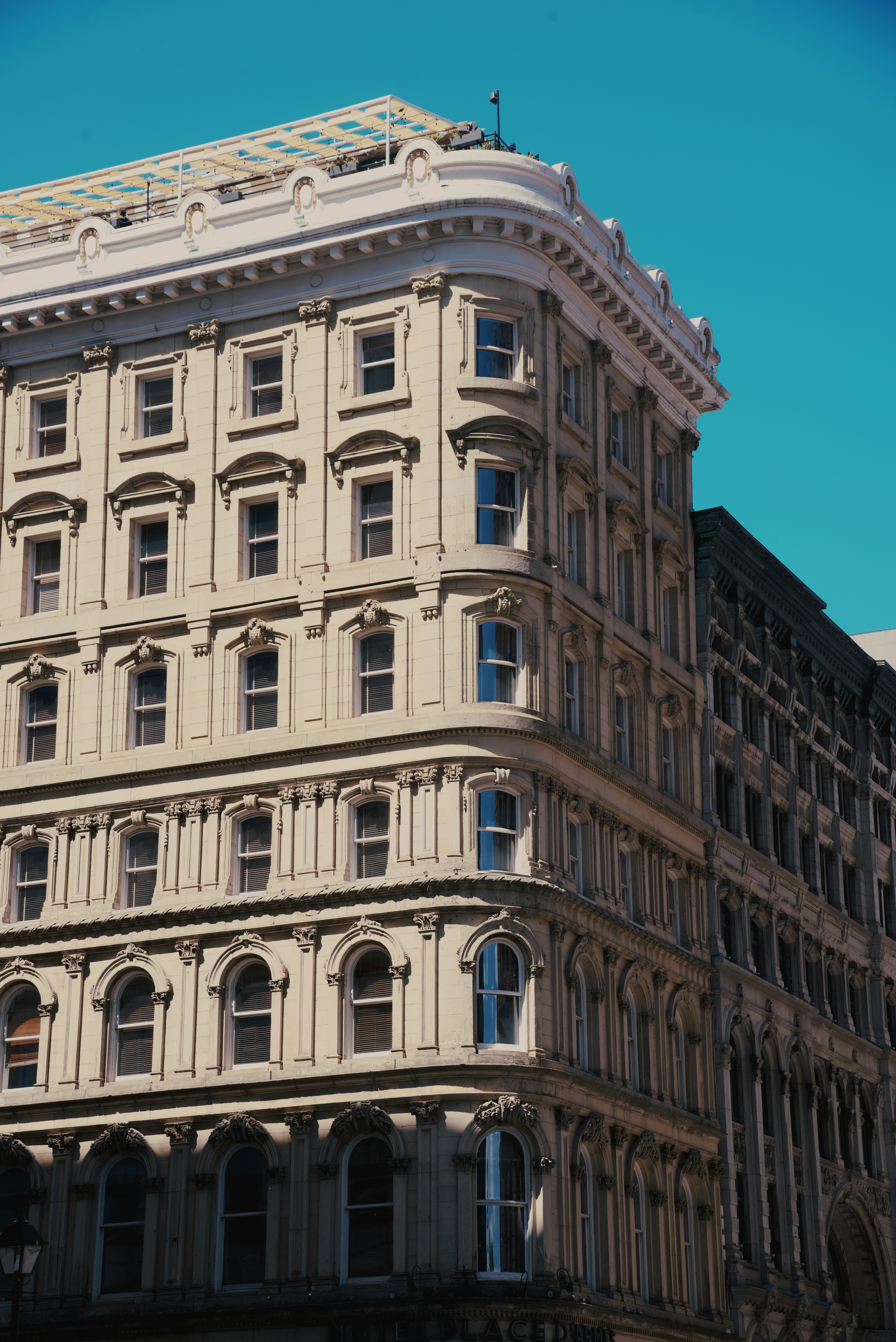 Cornered Grandeur: a sunlit façade of a historic corner building