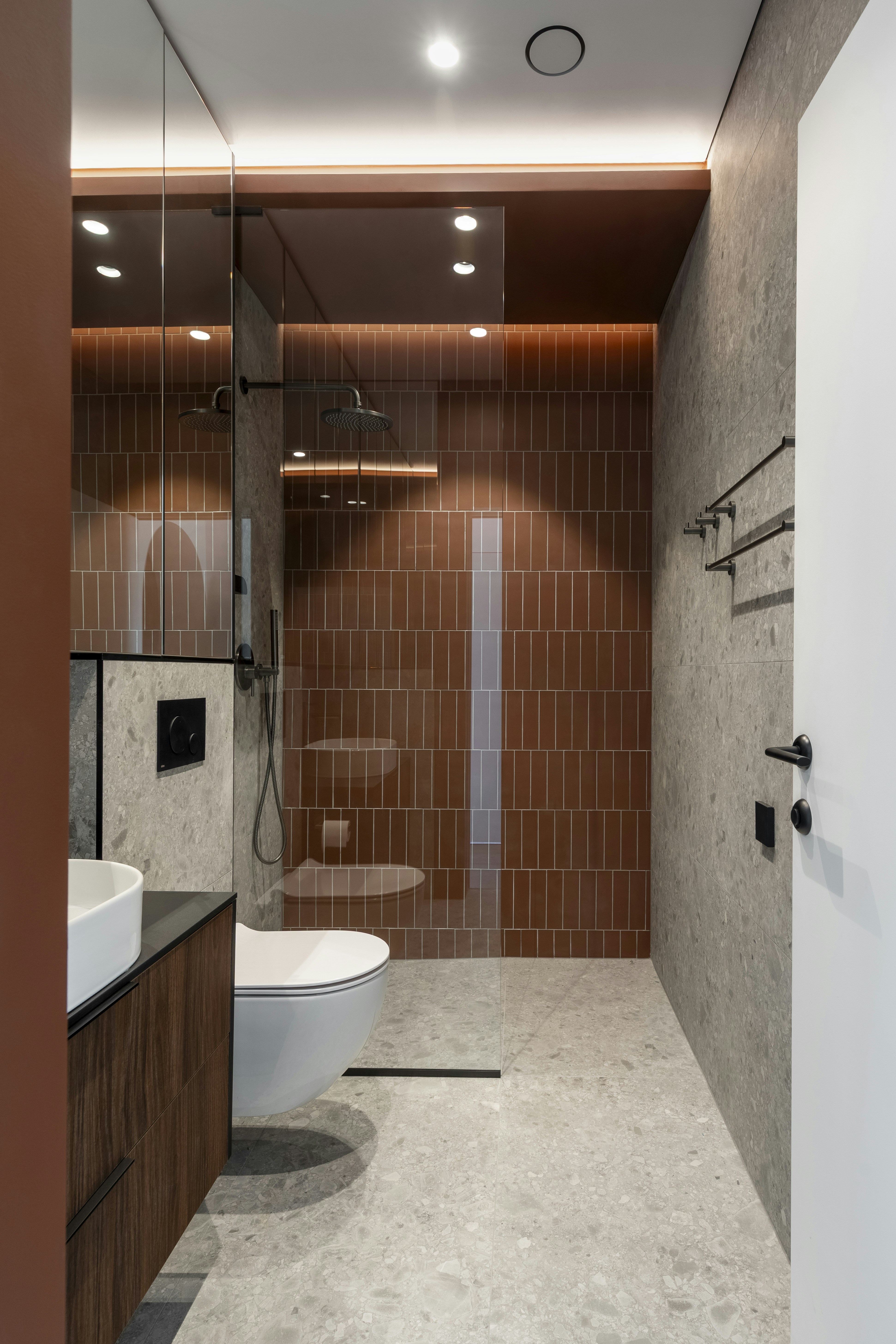 Minimalist Bathroom: Warm Tile Rows Meet Cool Concrete