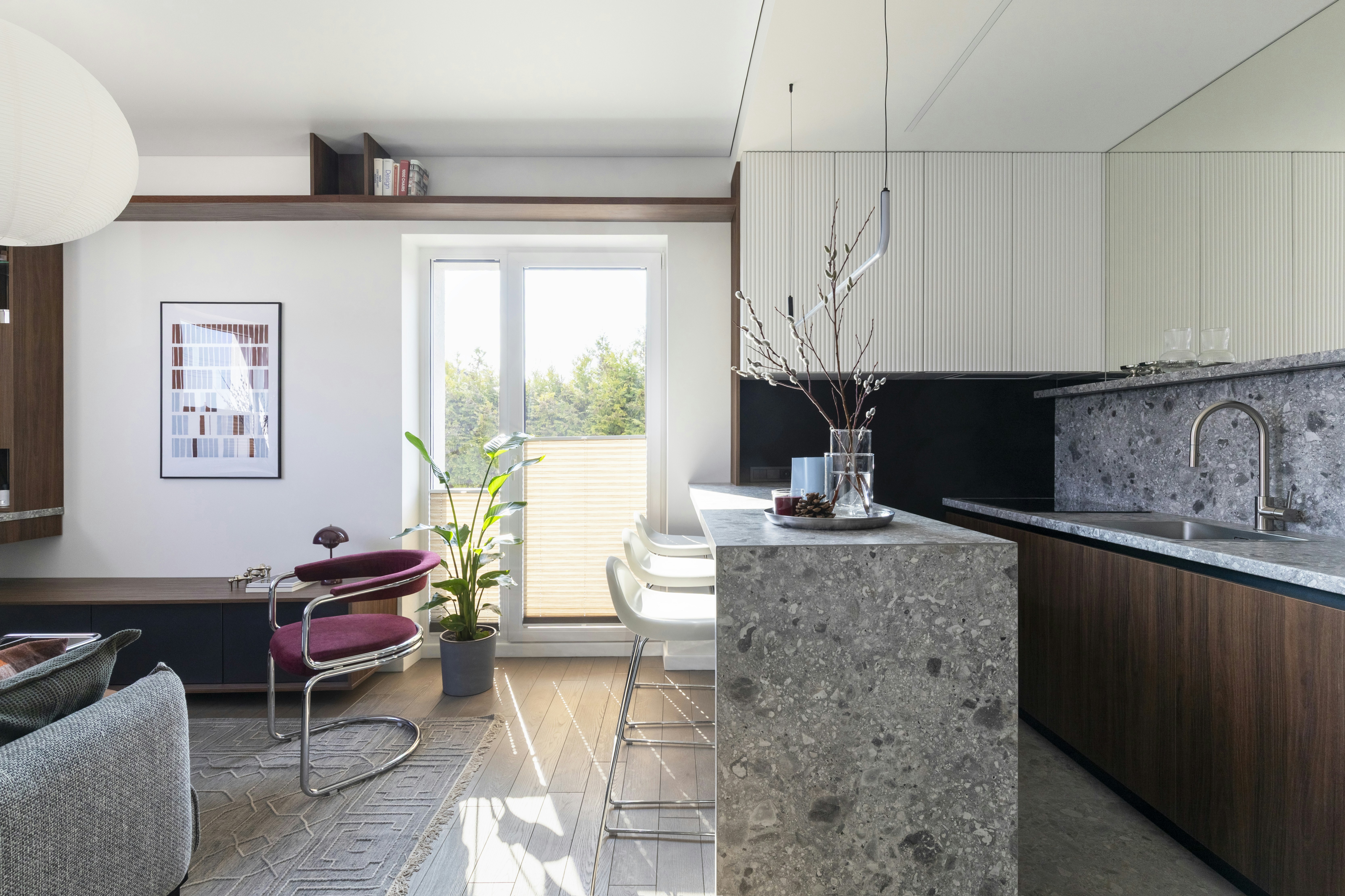 This 35 m² apartment in Vilnius is designed as a compact yet spatially fluid living environment, drawing on Mid-Century modern principles interpreted through a contemporary lens.