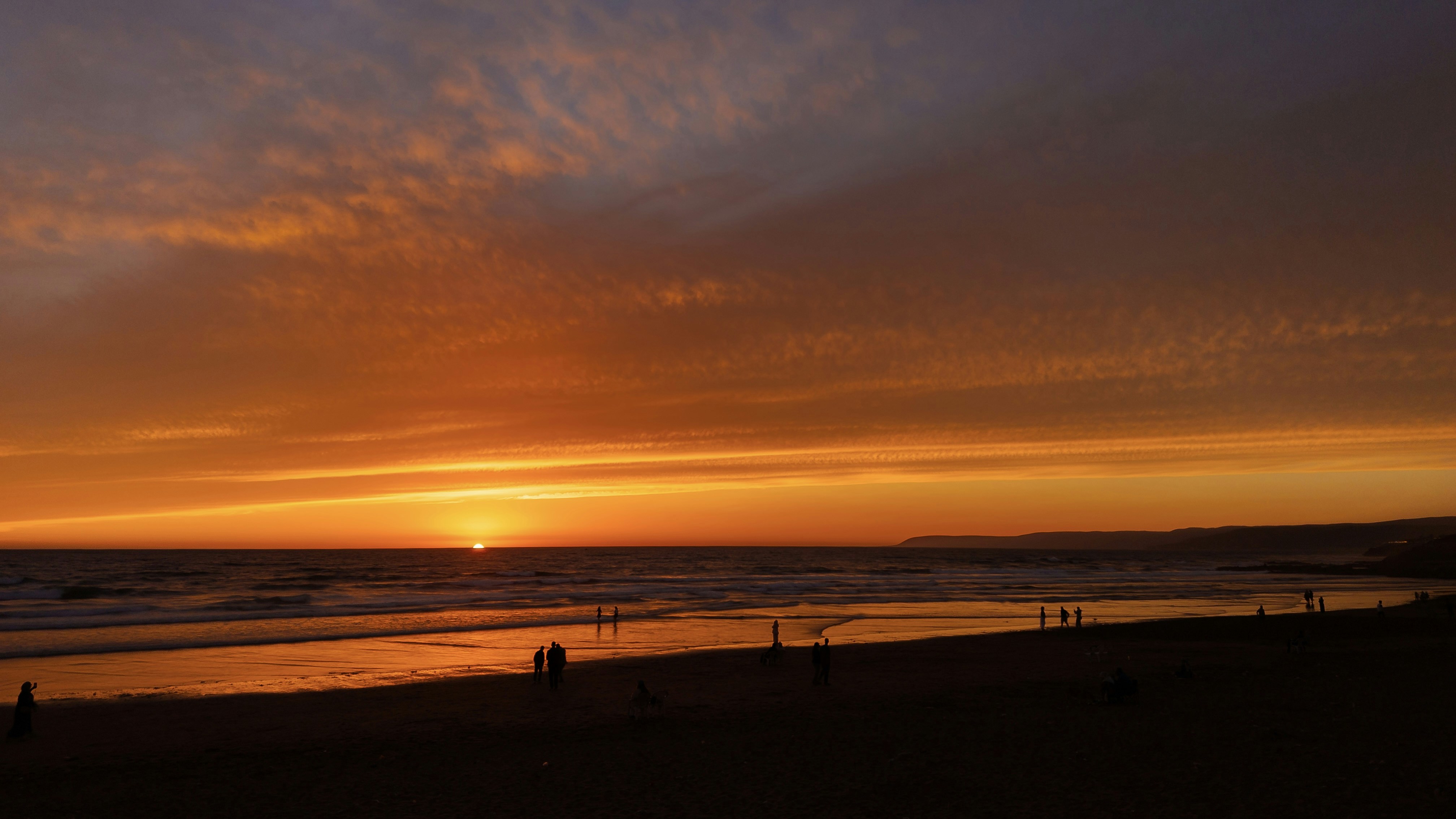 Dusk on the Quiet Shore: A Sunset Silhouette