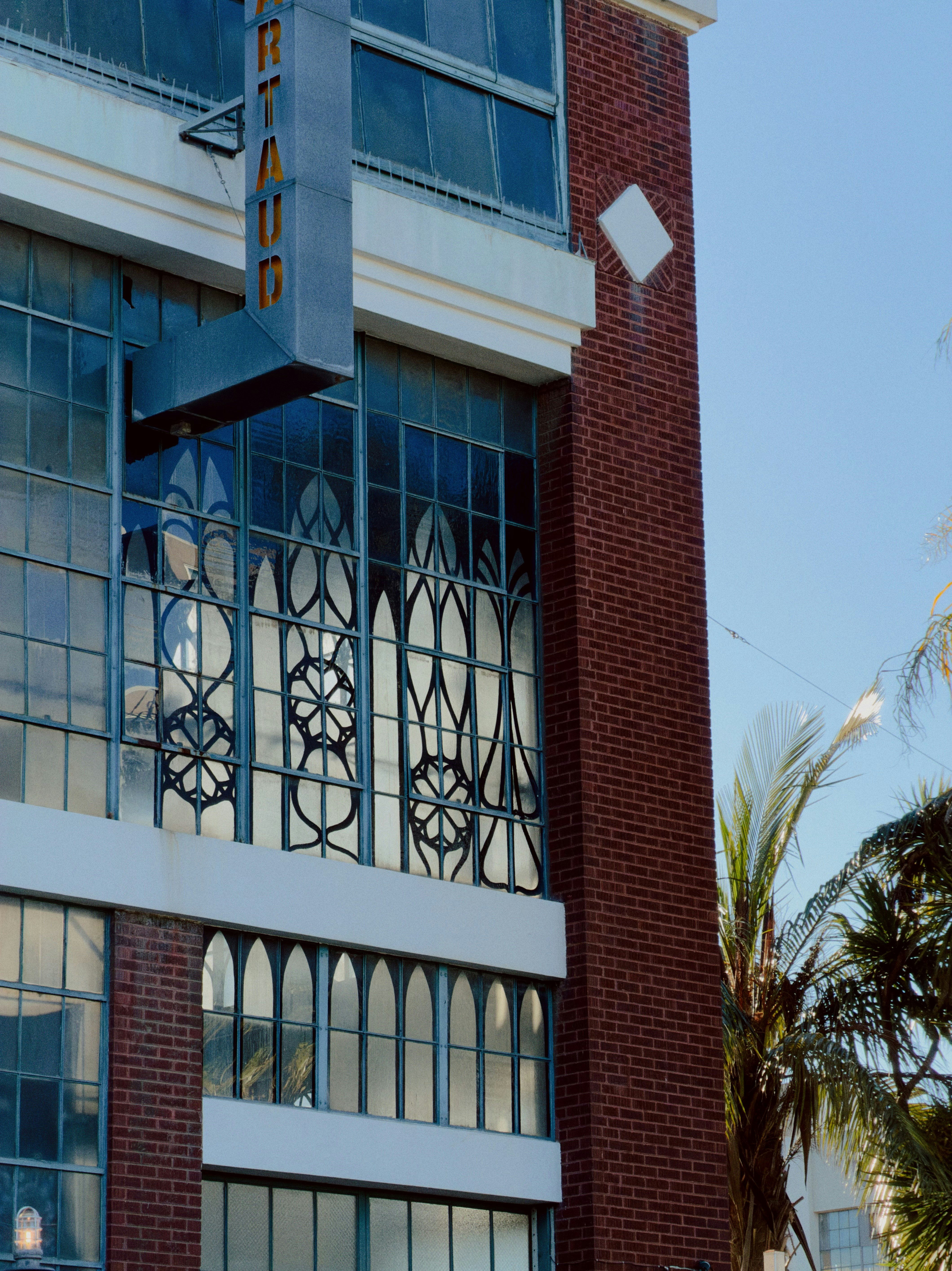 Brick Facade and Stained Glass Reflections of a Modern Arts Building