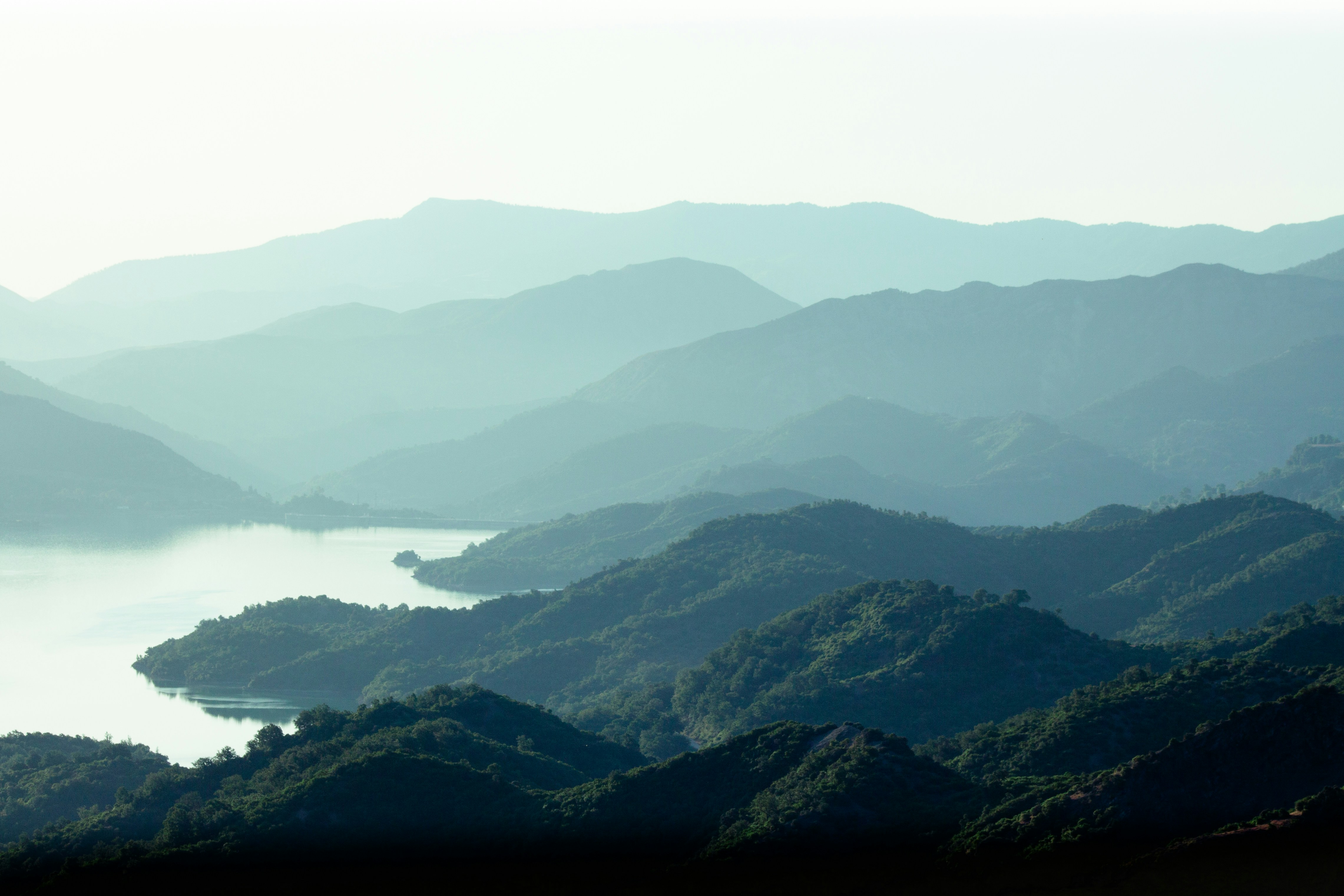 Mist Over Multilayered Ridge: A Quiet Dawn Over the Valley