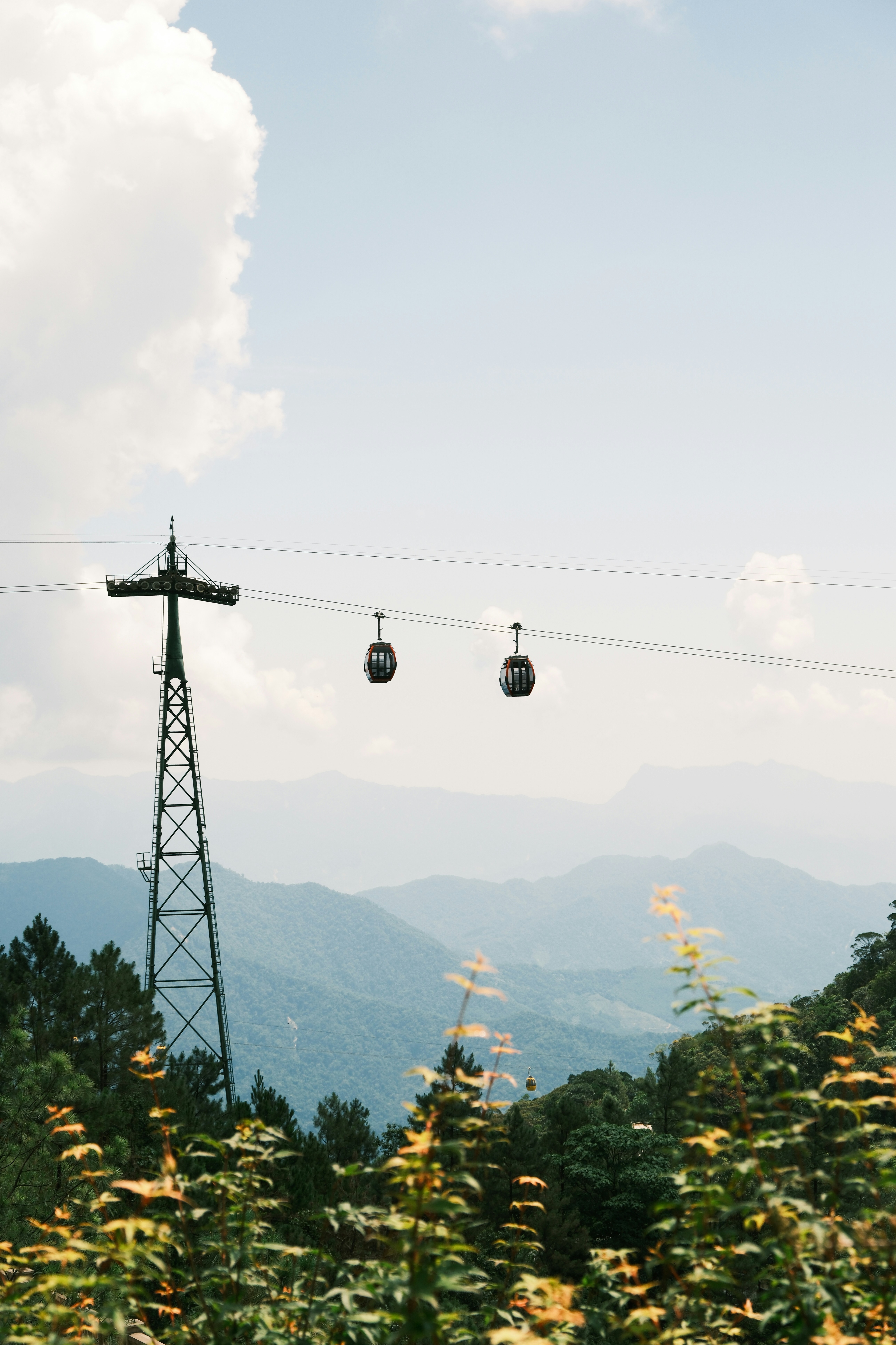 Cabled Skyline: A Duo of Gondola Cars Across the Alpine Expanse