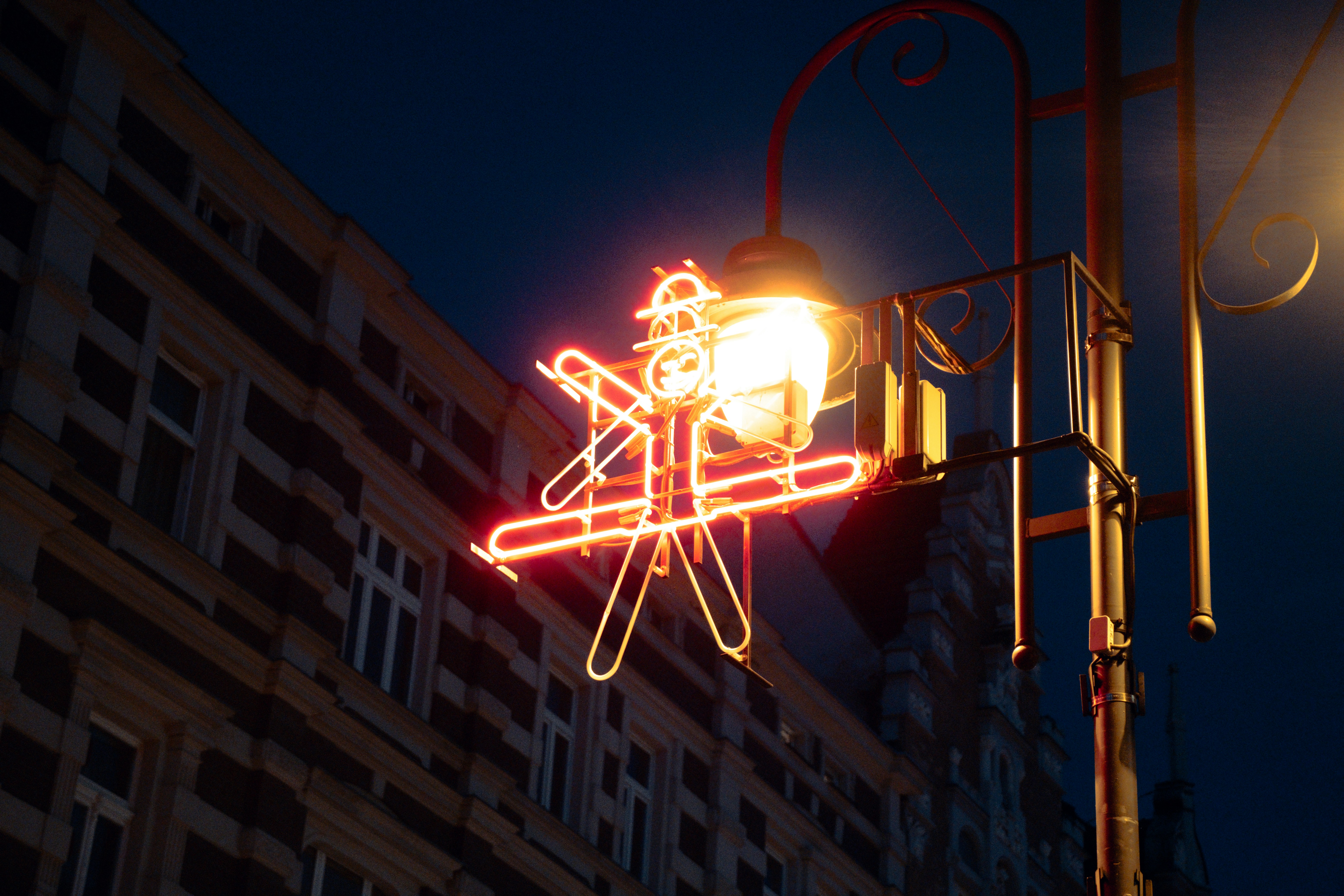 Neon Snowflake over a Quiet City Street