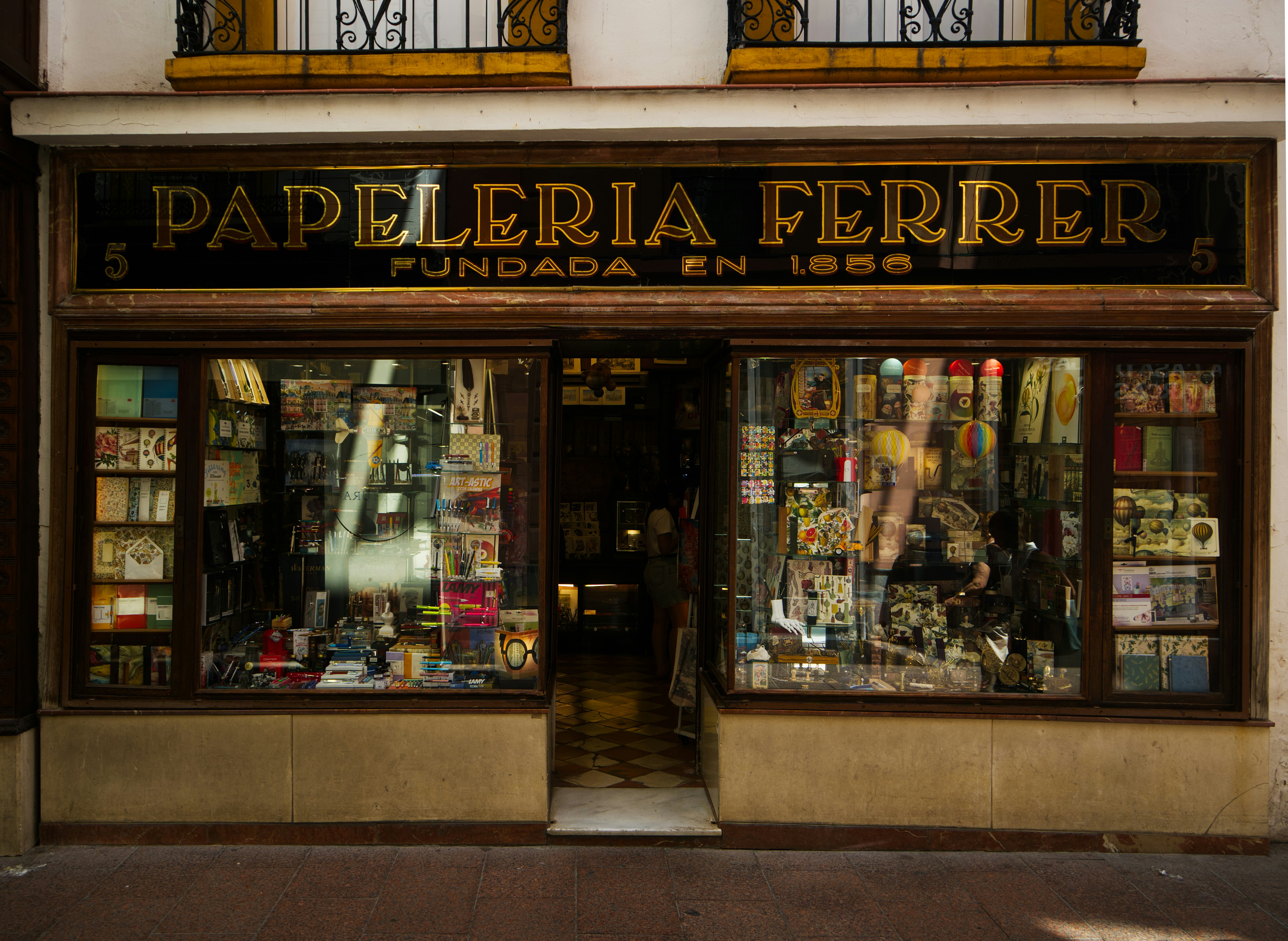 Papeleria ferrer stationery shop storefront with display windows.