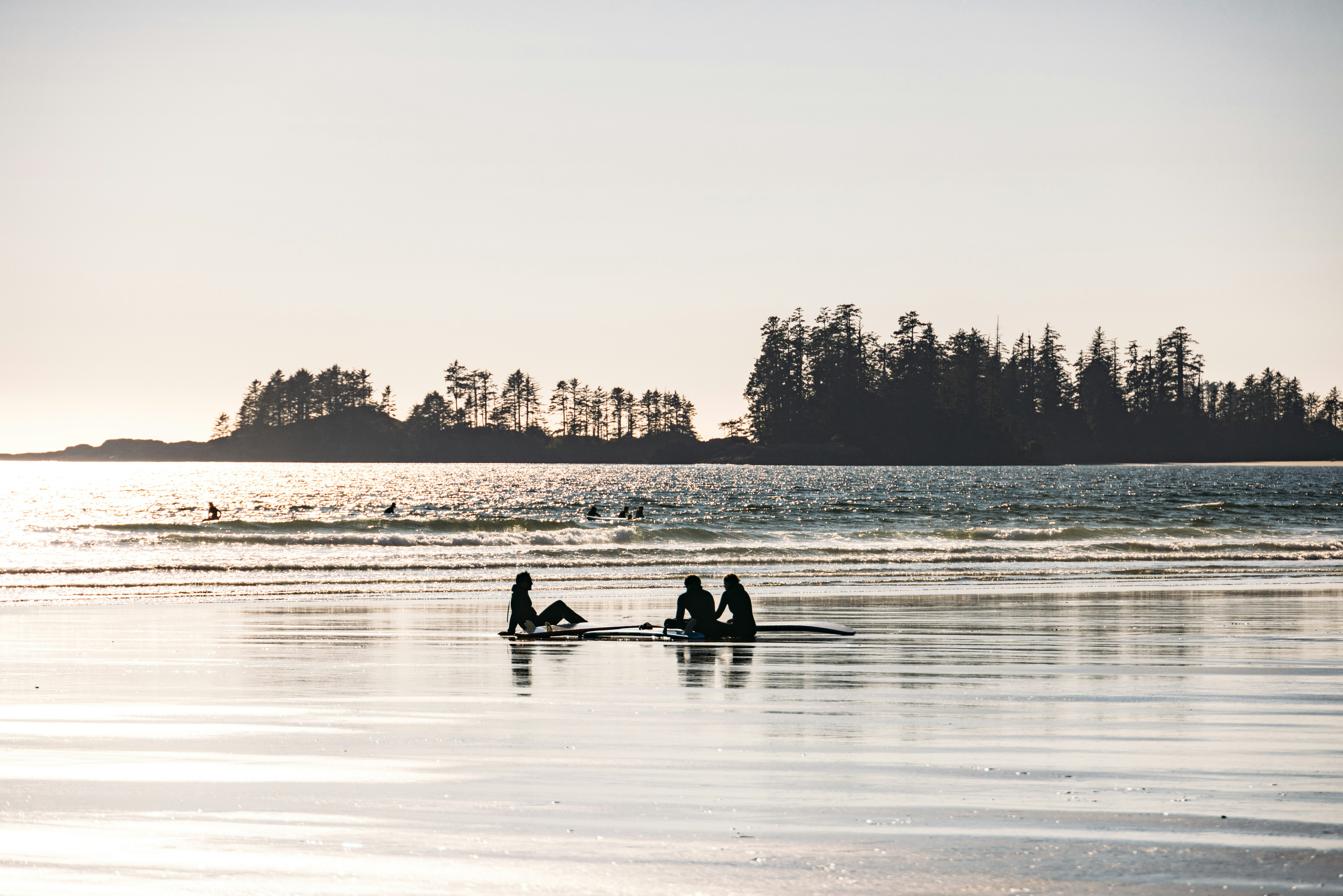 Sunlit Silhouette: A Small Row Between Island Silhouettes