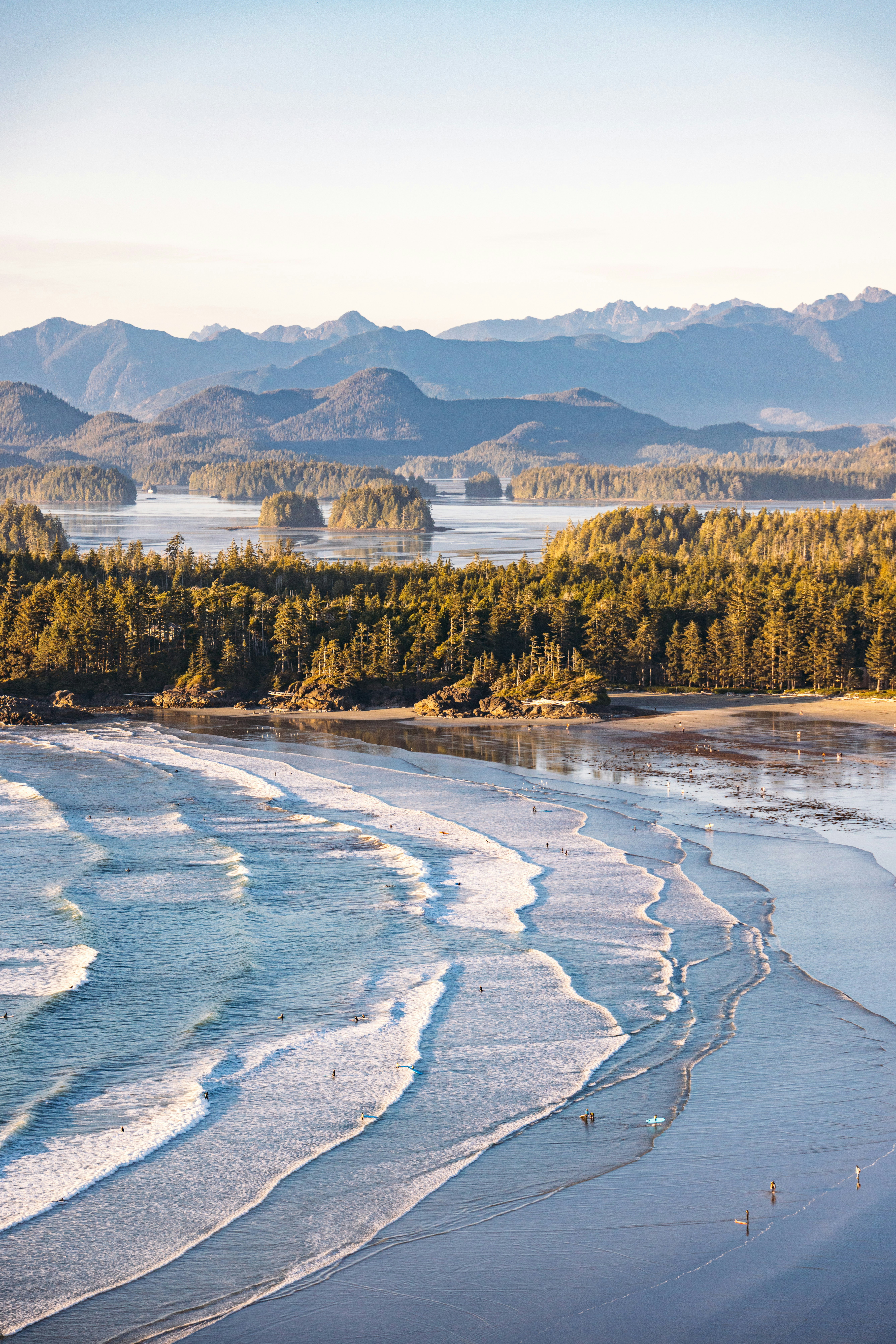 Dawn over謎 Coastal Pines: Snow-Lined Waves and Islanded Forests