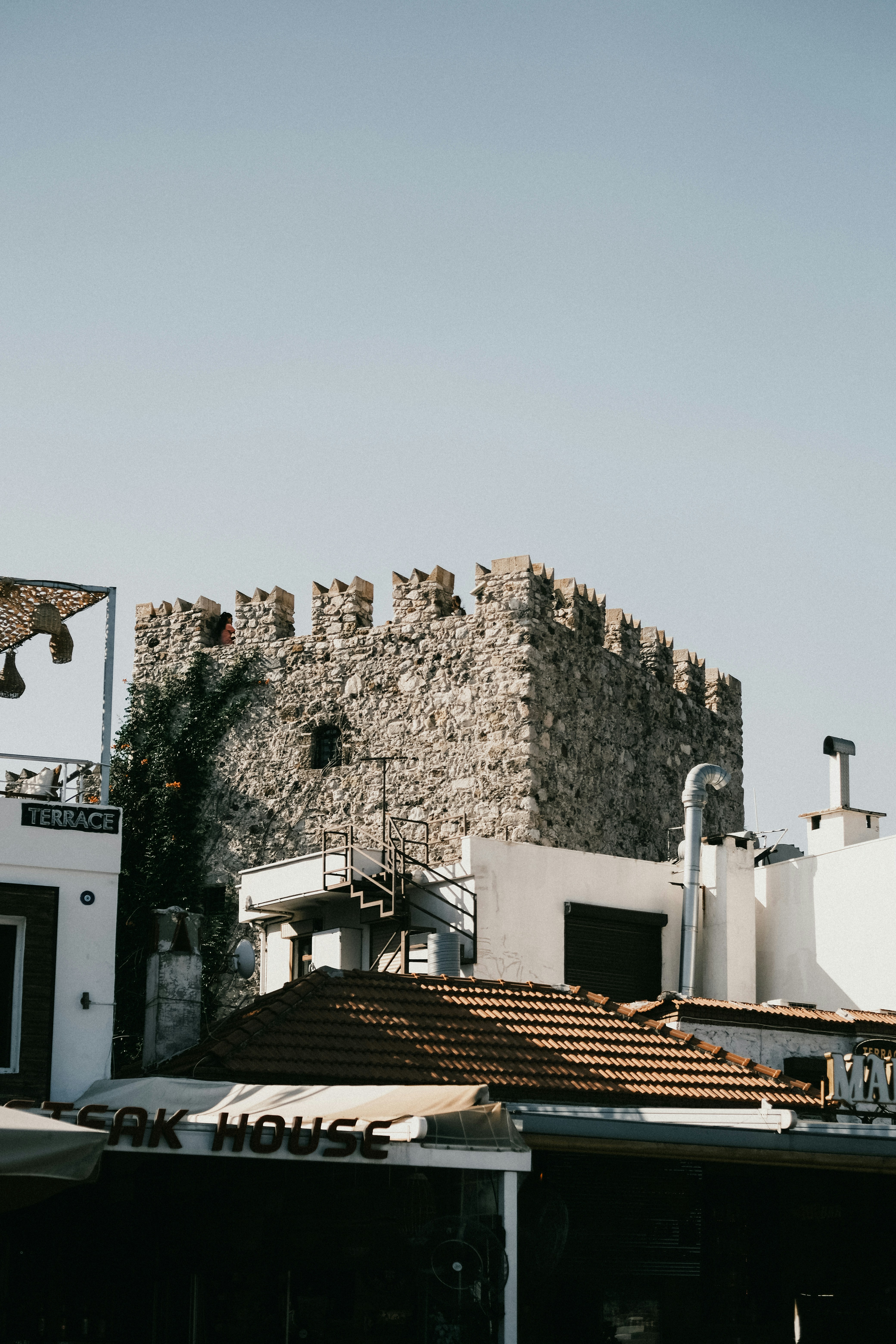 Stone Turret Overhang: A Mediterranean Street Scene