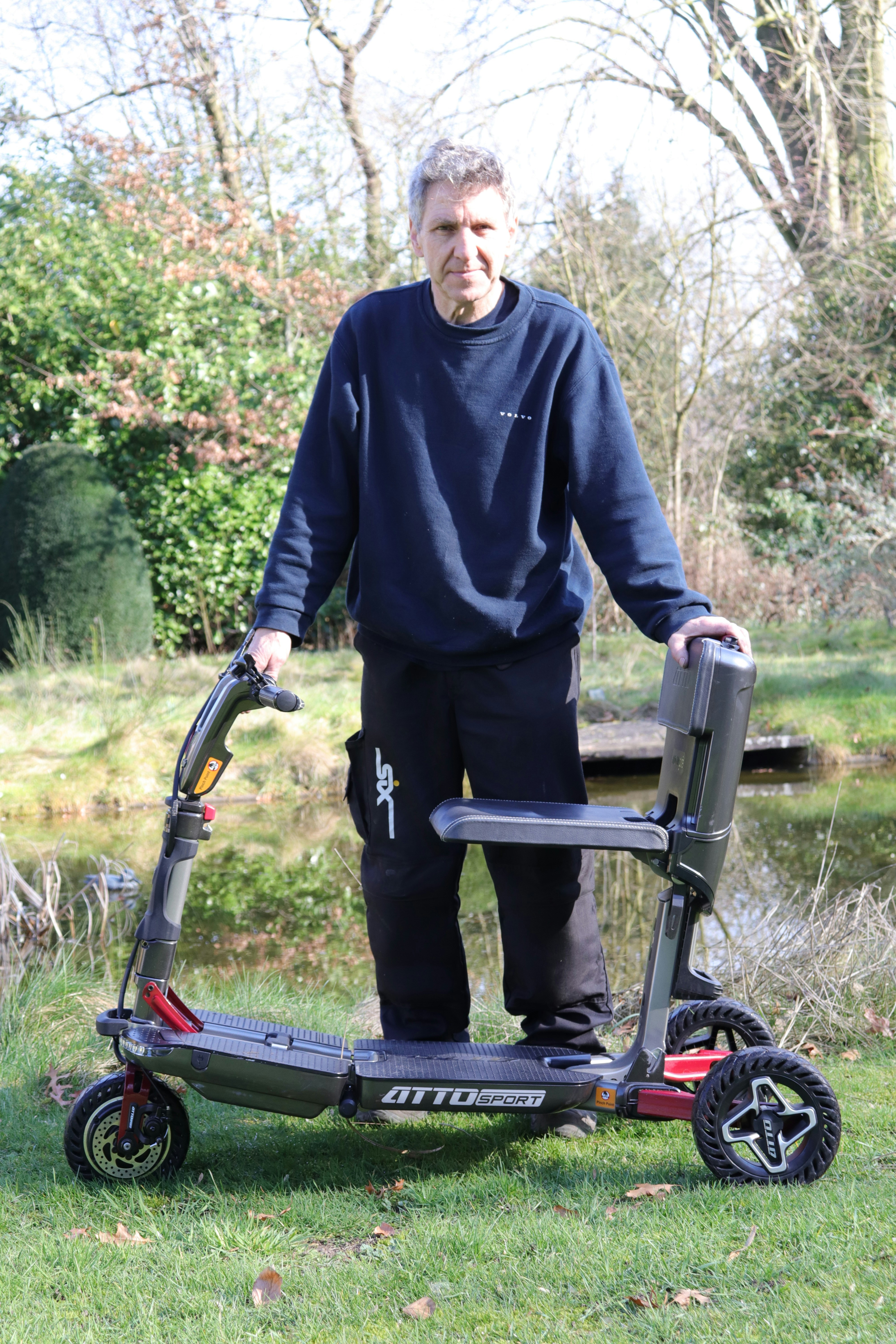 Gentleman in a Park with Electric Scooter