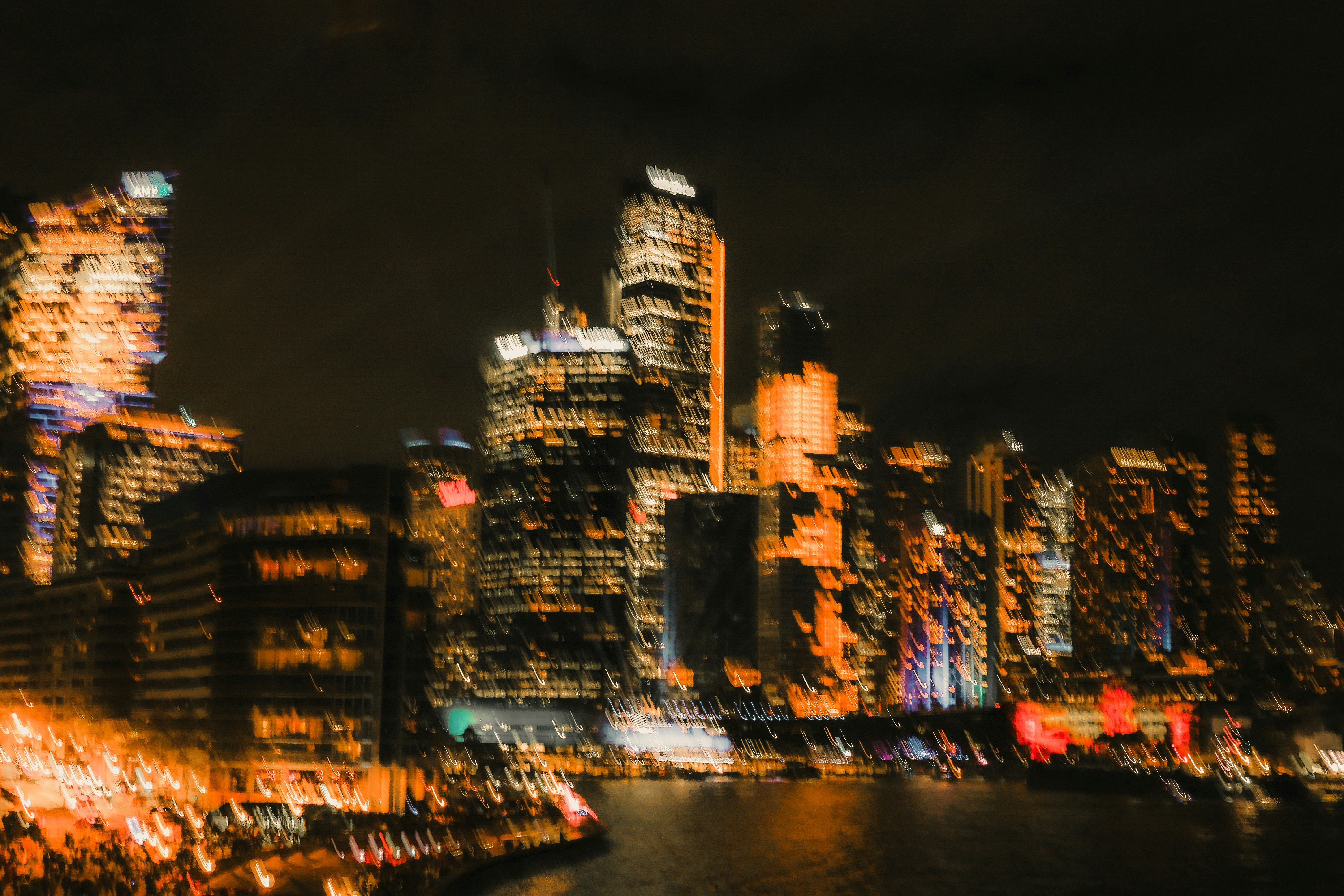 Night Mosaic: Blurred Skyline Bisected by Golden Lights