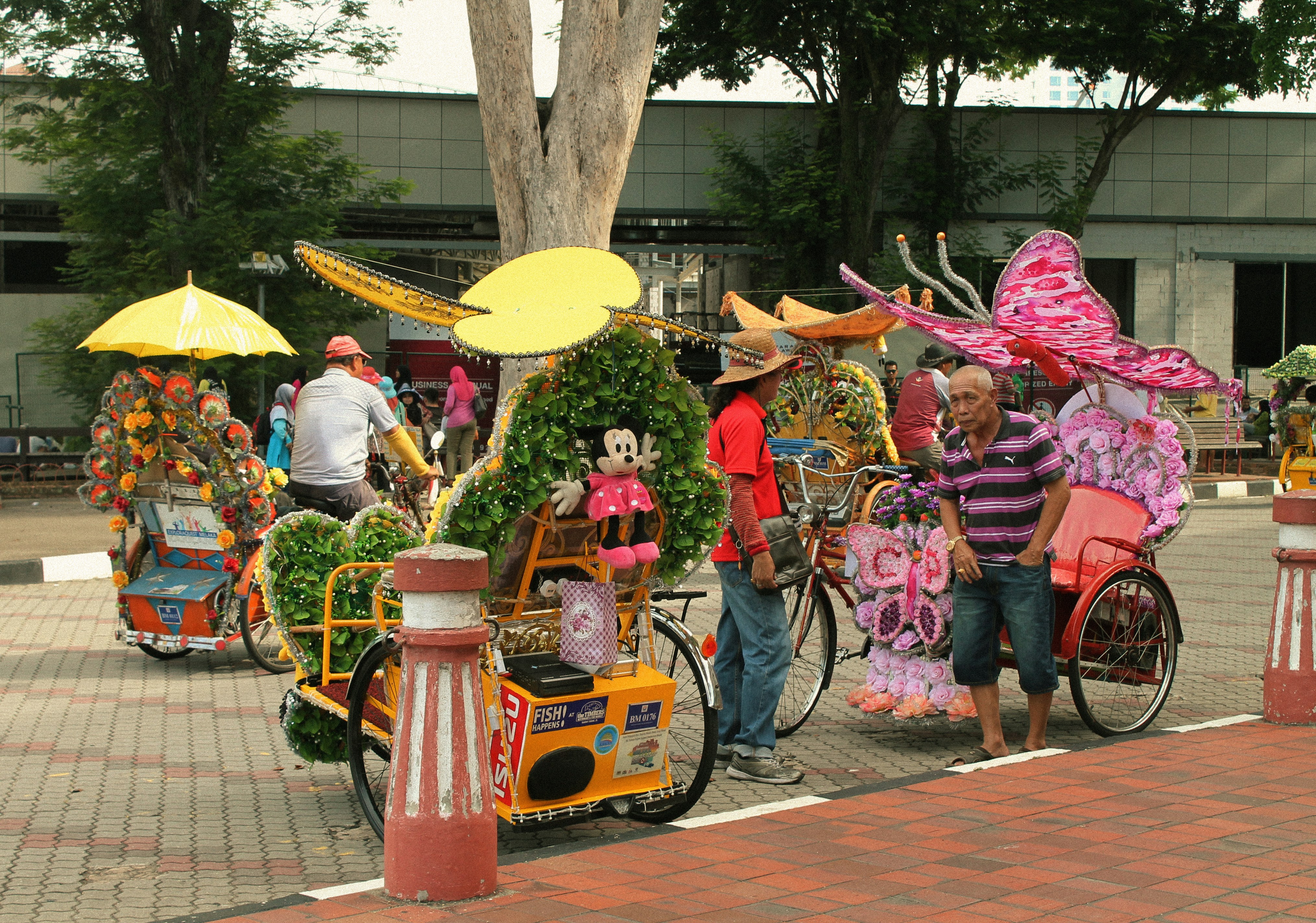 Colorful Pedicab Parade: Sunlit Cartons and Shrugged Street Vendors