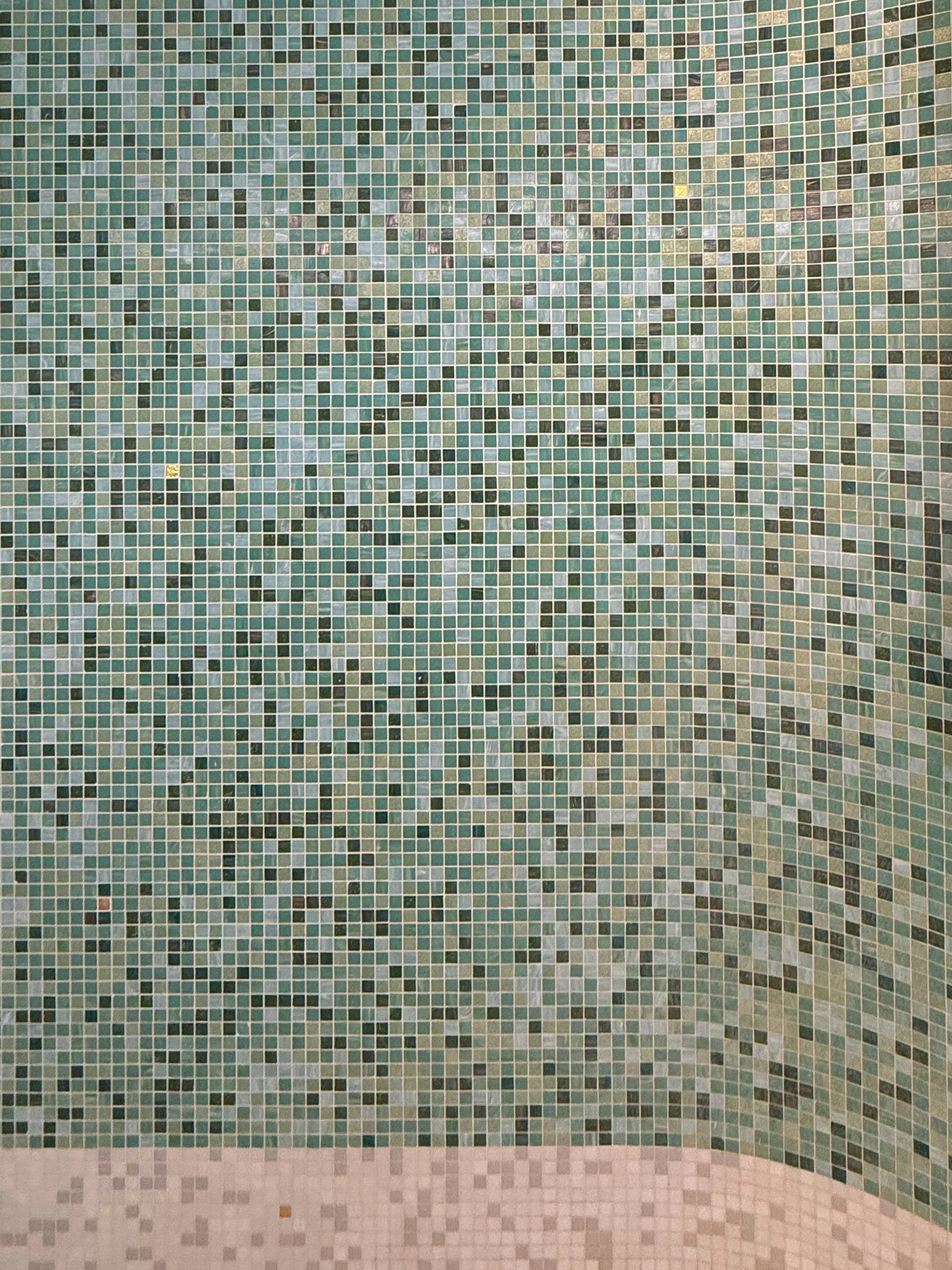 Mosaic Gradient: Seafoam Tiles Across a Curved Pool Wall