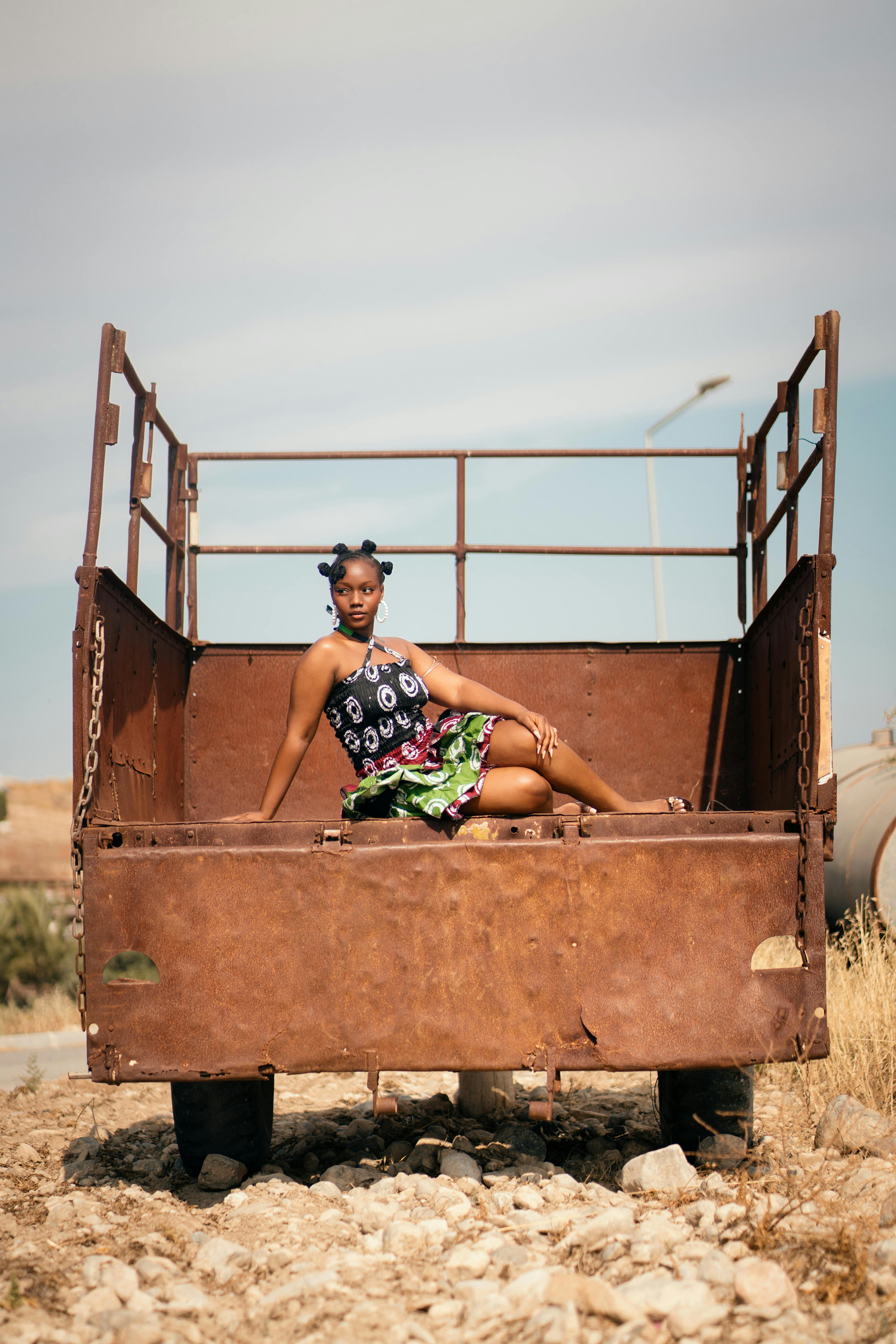 Portrait in a Rusted Truck Bed: Quiet Confidence in an Abandoned Lot