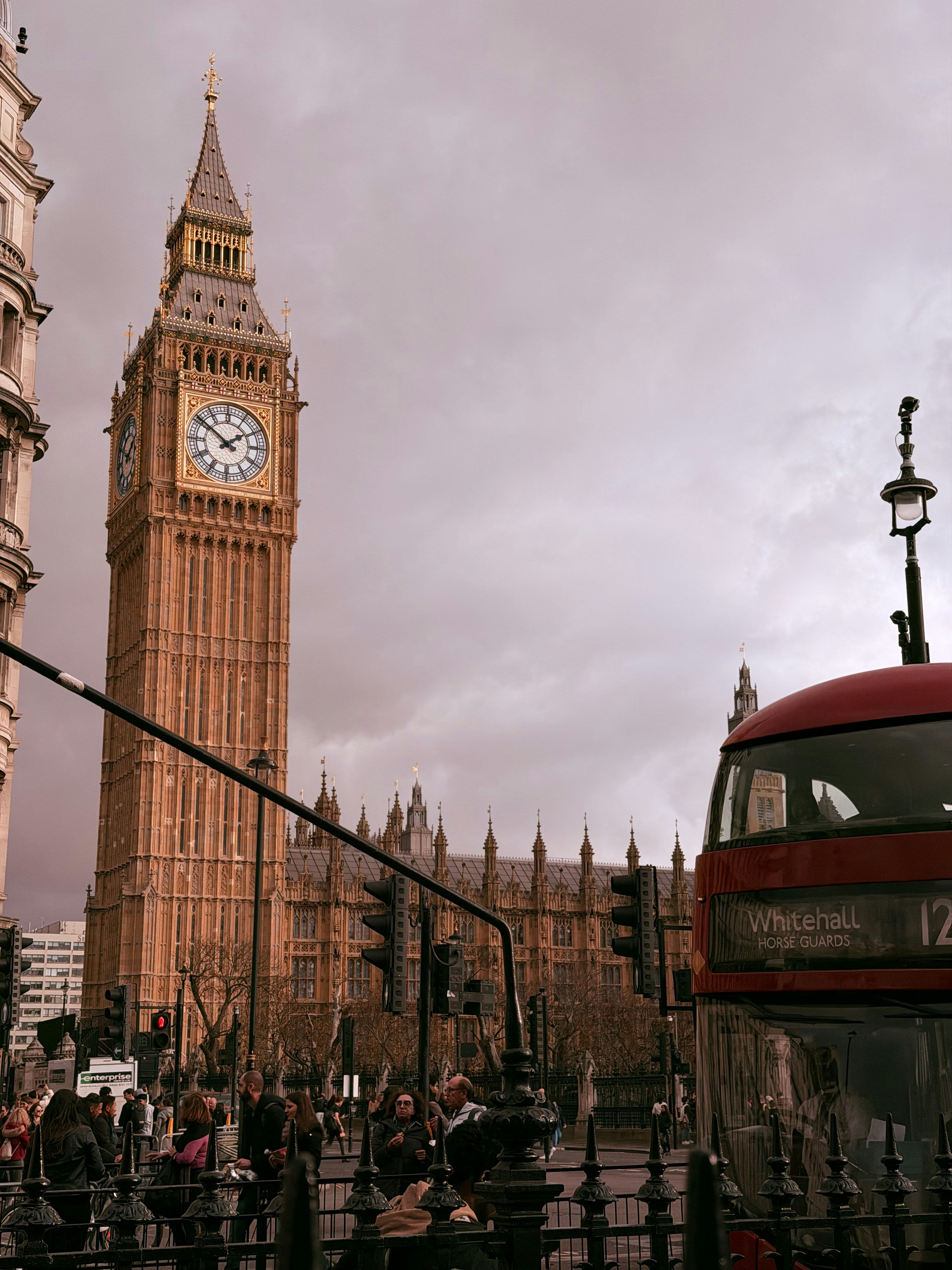 Clocktower Crossing: Big Ben Over Red Bus and City Dusk