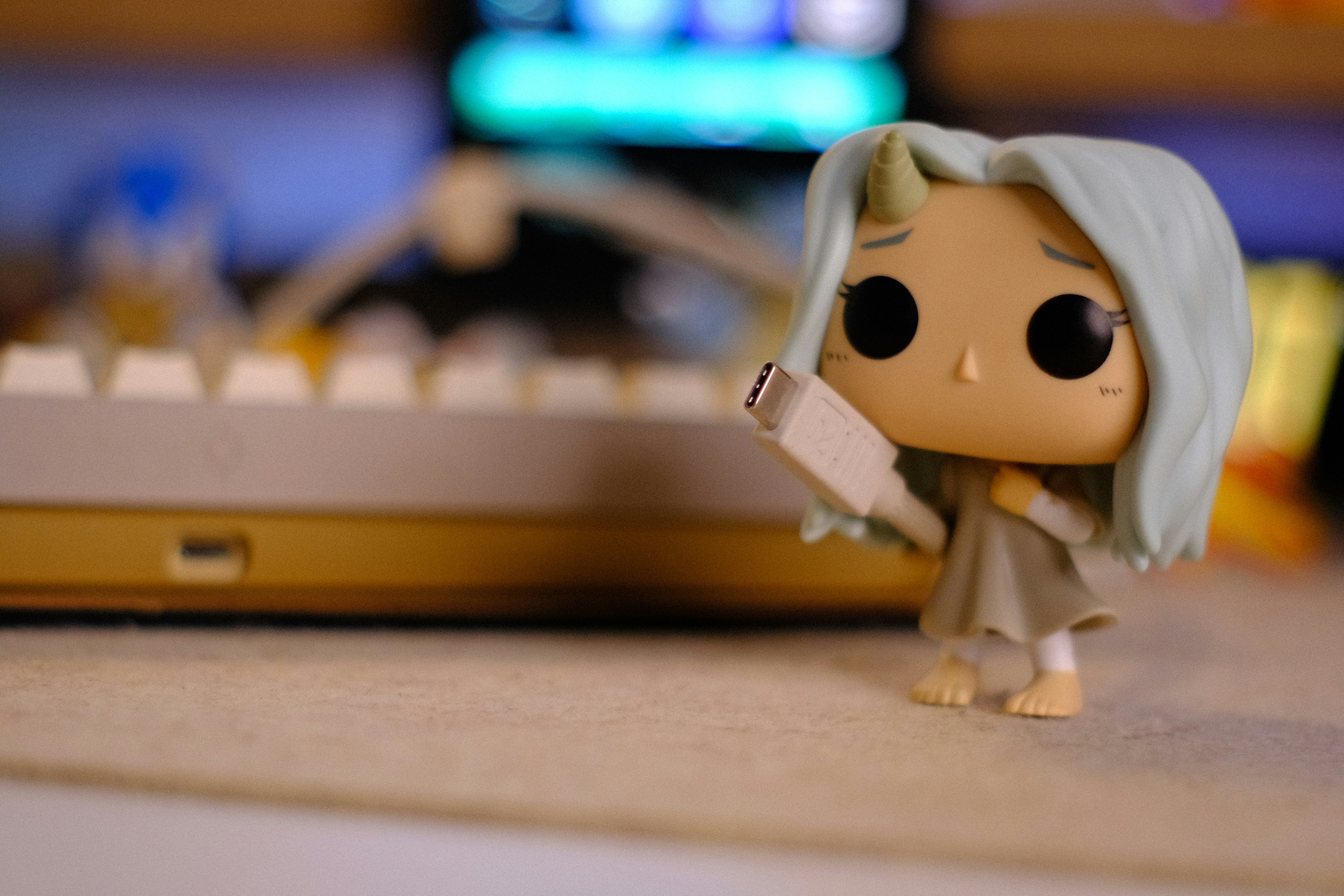 Tiny figure with a VHS-like backdrop: a playful scene unfolds at close range