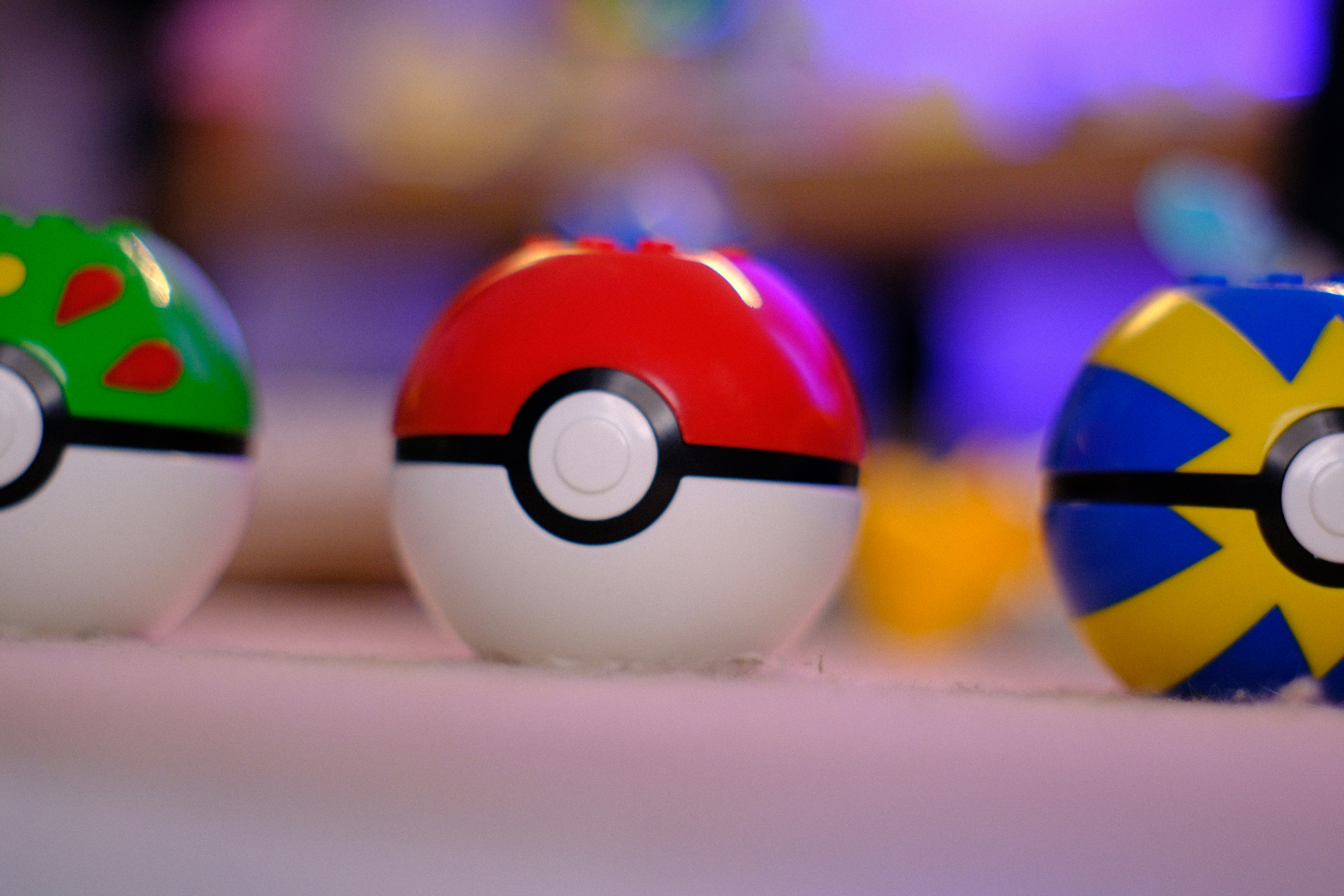 Red, green, and blue pokeball-like objects.