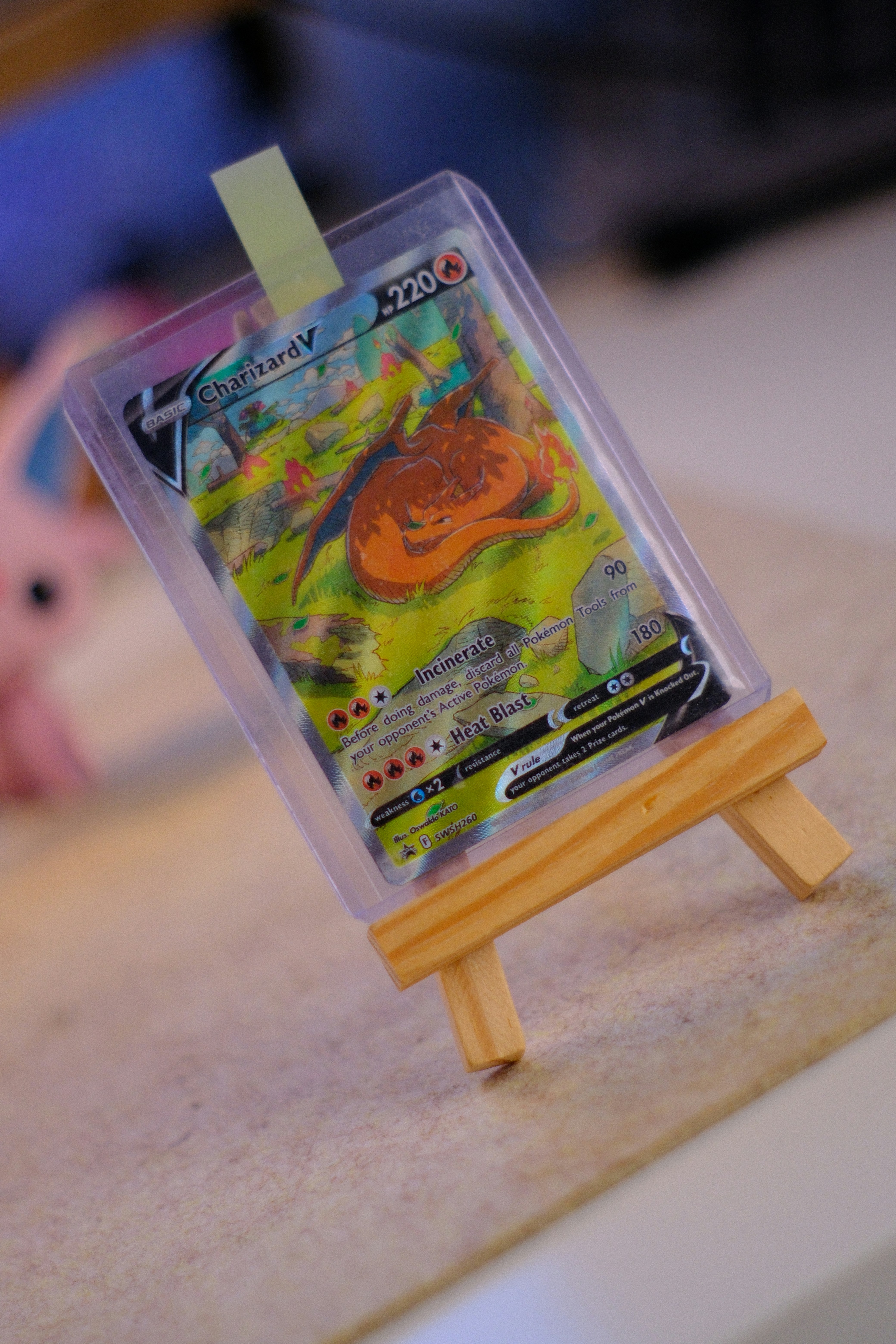 Charizard V in a Tiny Display: A Pocket Dragon on a Mini Easel