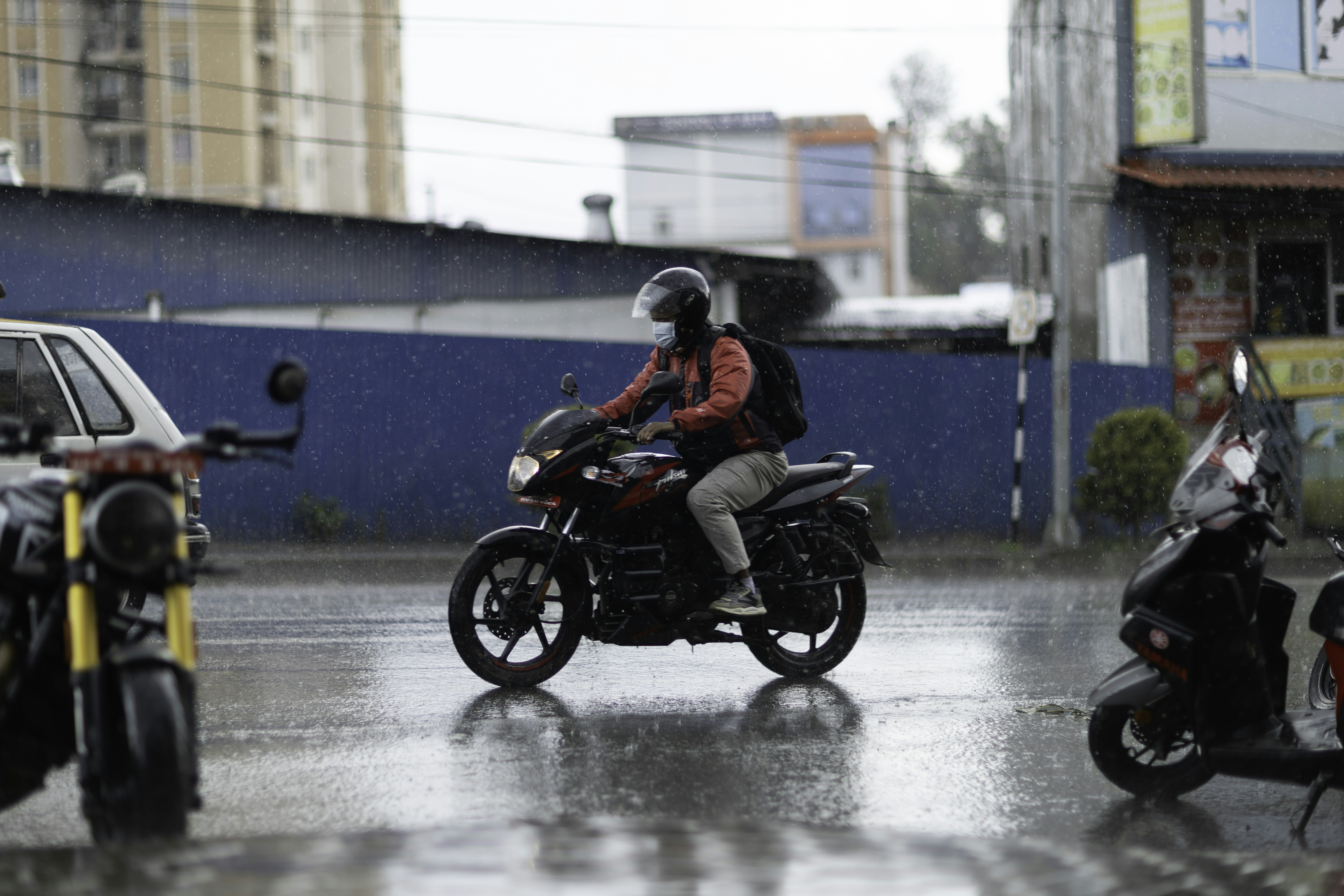 Person riding a motorcycle on a wet street during rain photo – Free ...