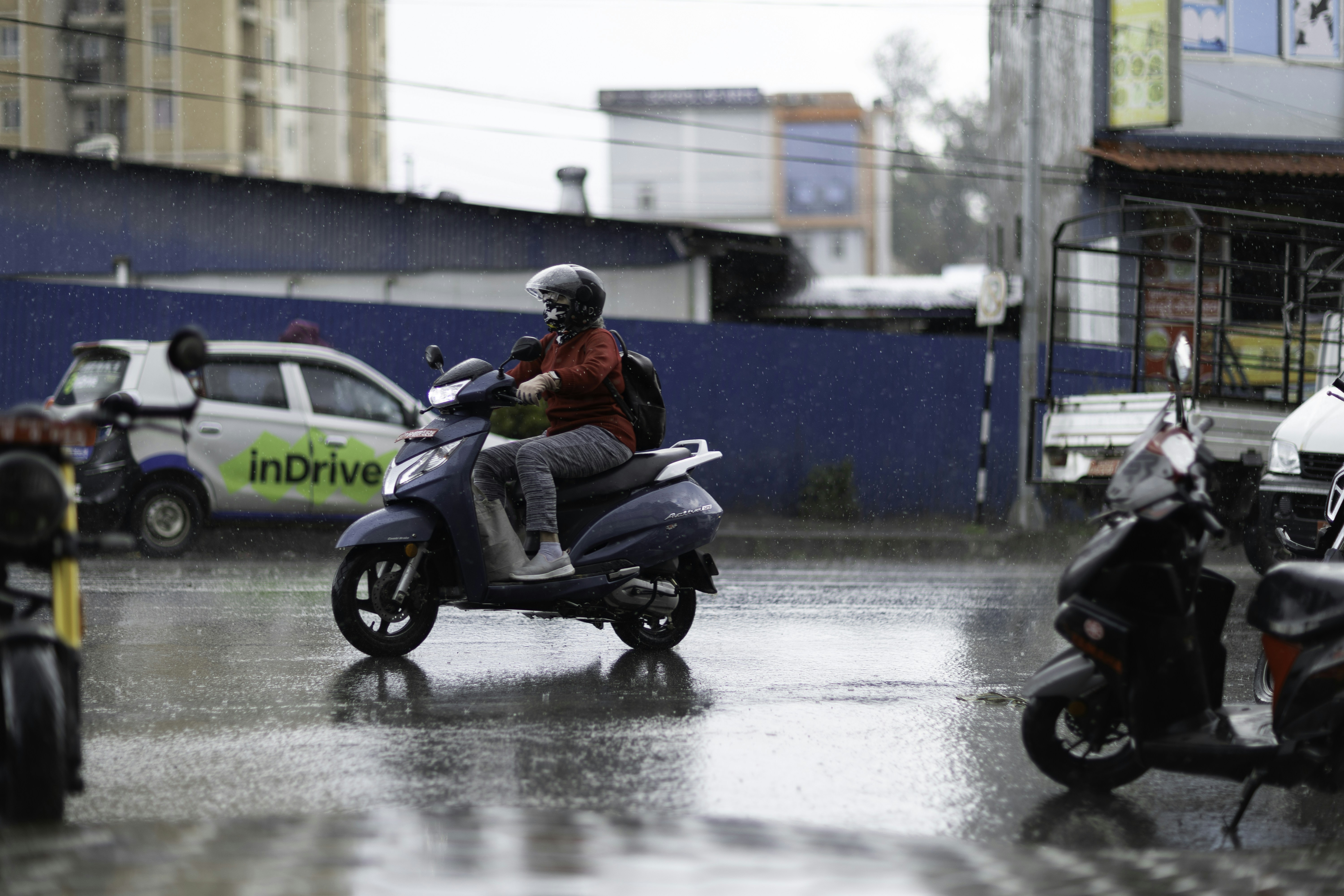 People Rushing Through Rain – Busy City Life in Monsoon
