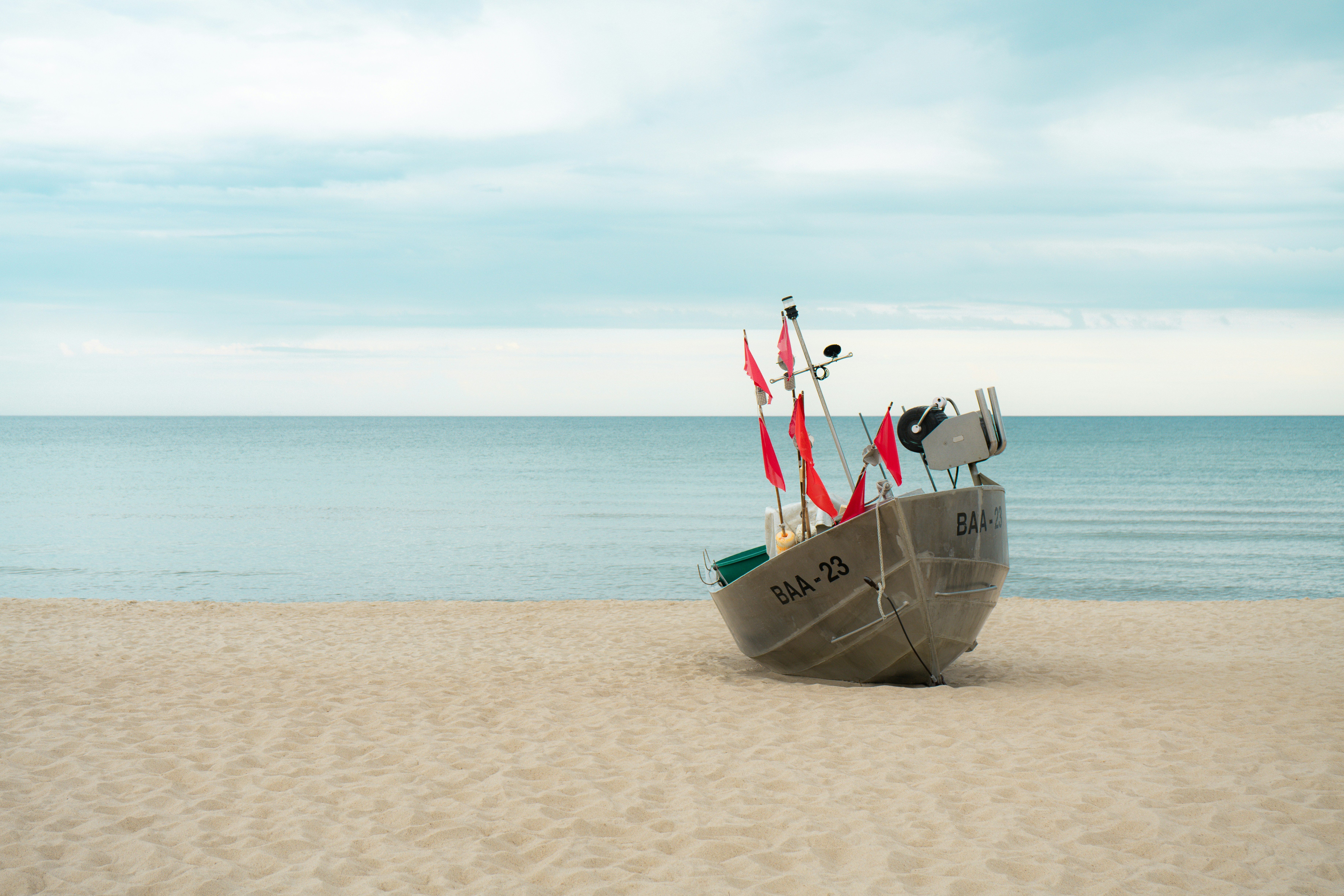 The Reef-White Vessel Resting on Sunlit Sand