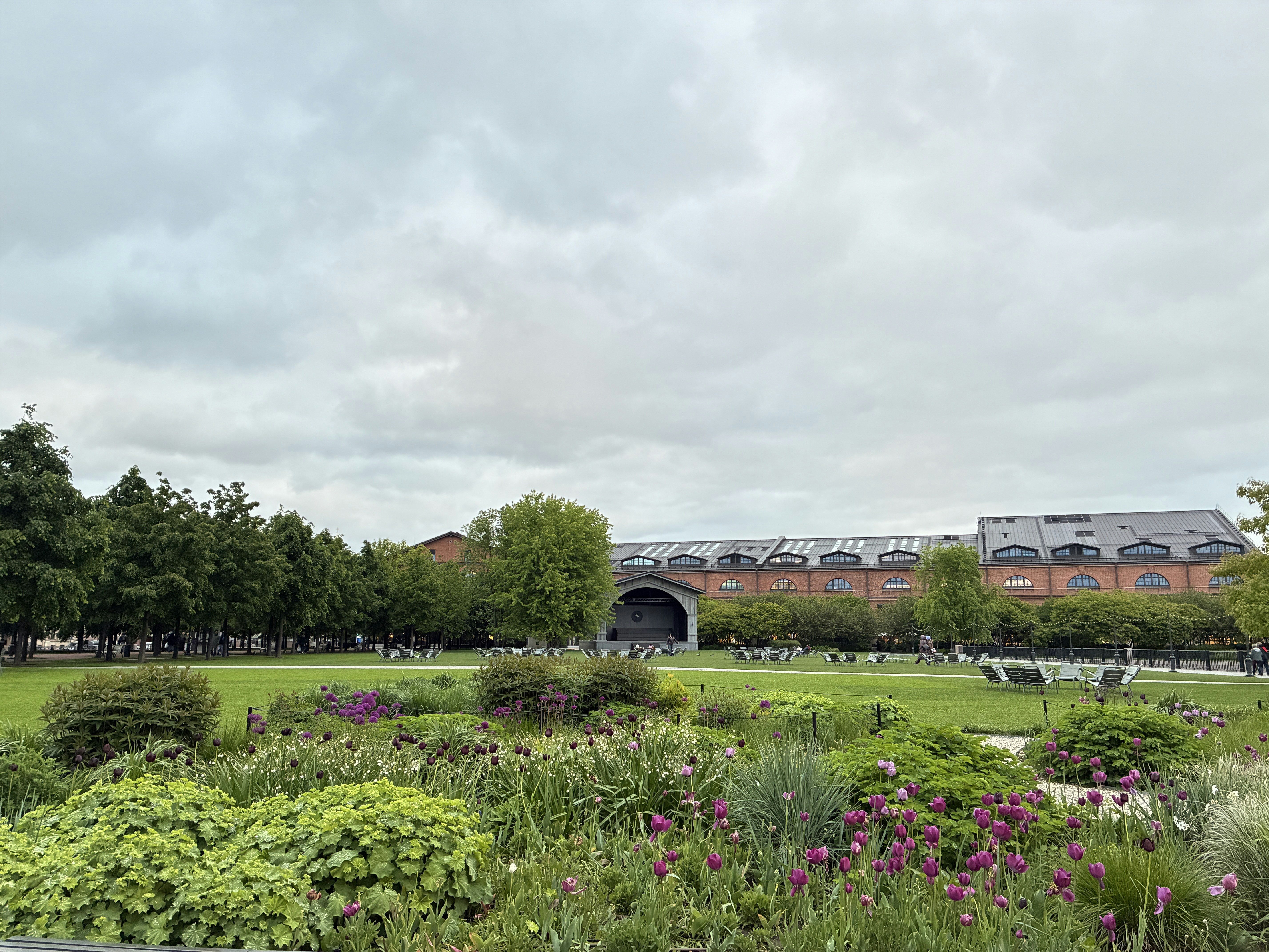 Symmetrical Grounds: Garden Pathway Framed by Historic Brickwork