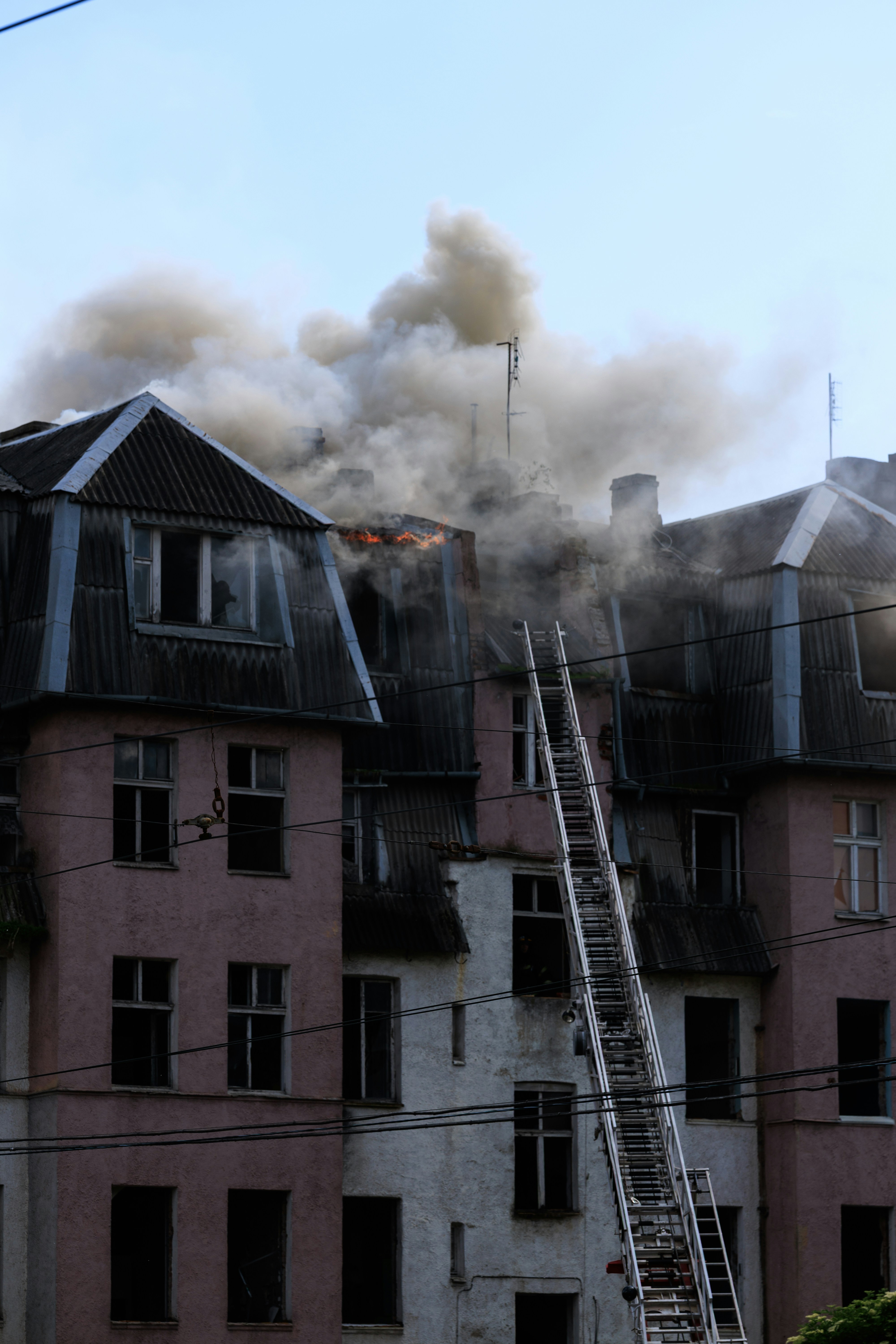Smoke over a multi-story fire in an urban apartment block