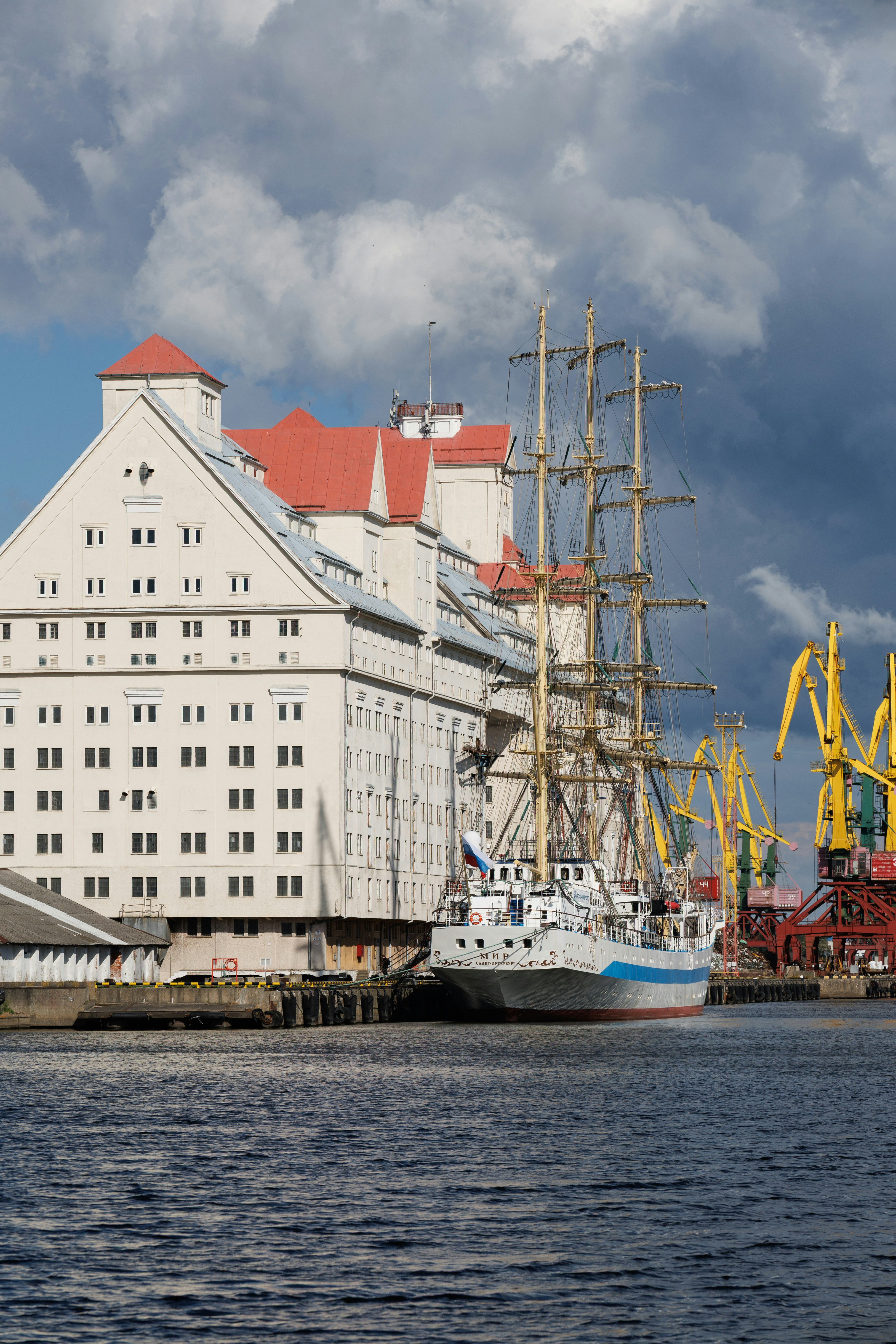 Harbor Heritage: A Sail-Decked Dock by the White Confections