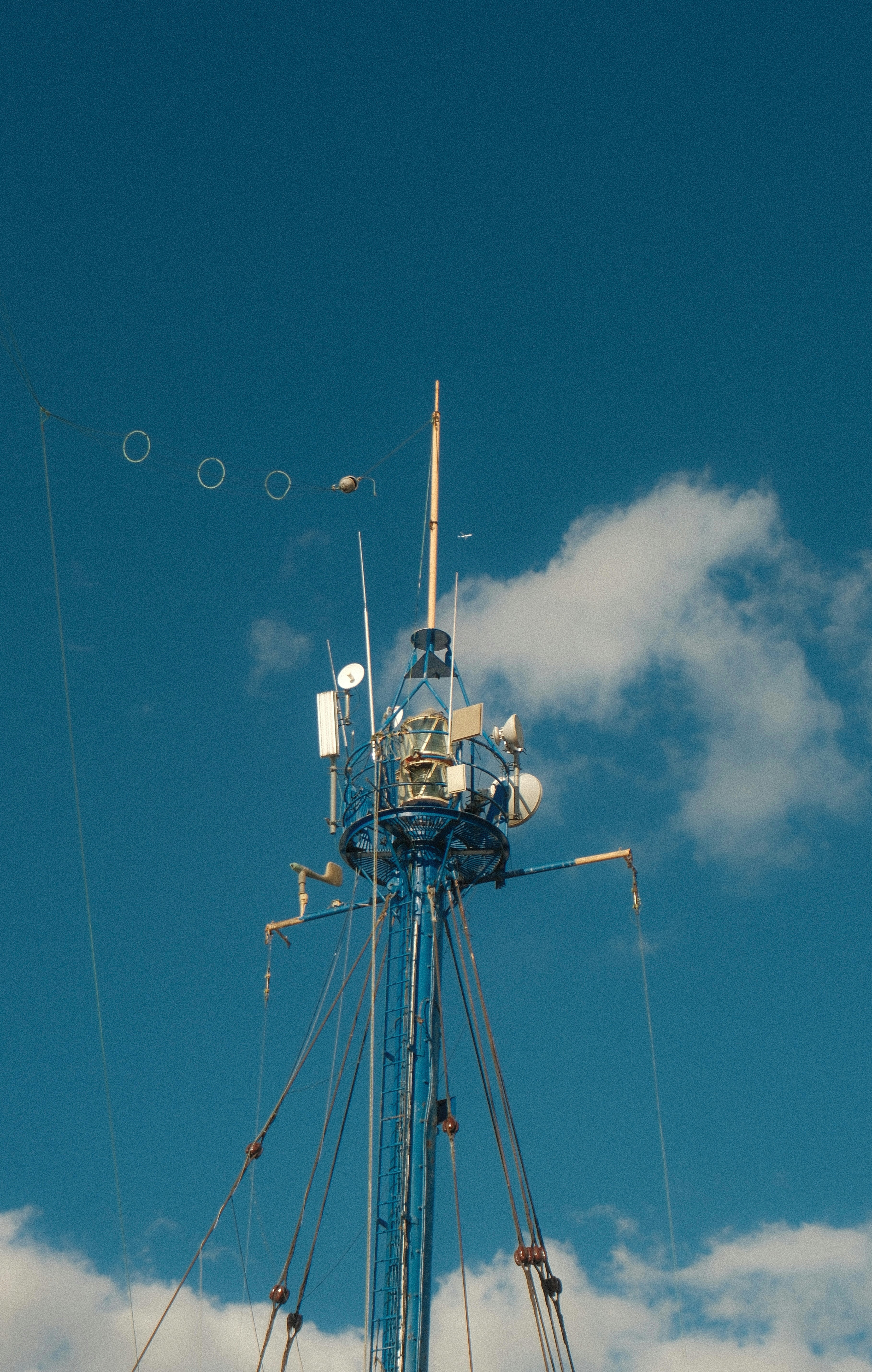 Skyward Sentinel: A Blue Tower Reaching for the Stratosphere