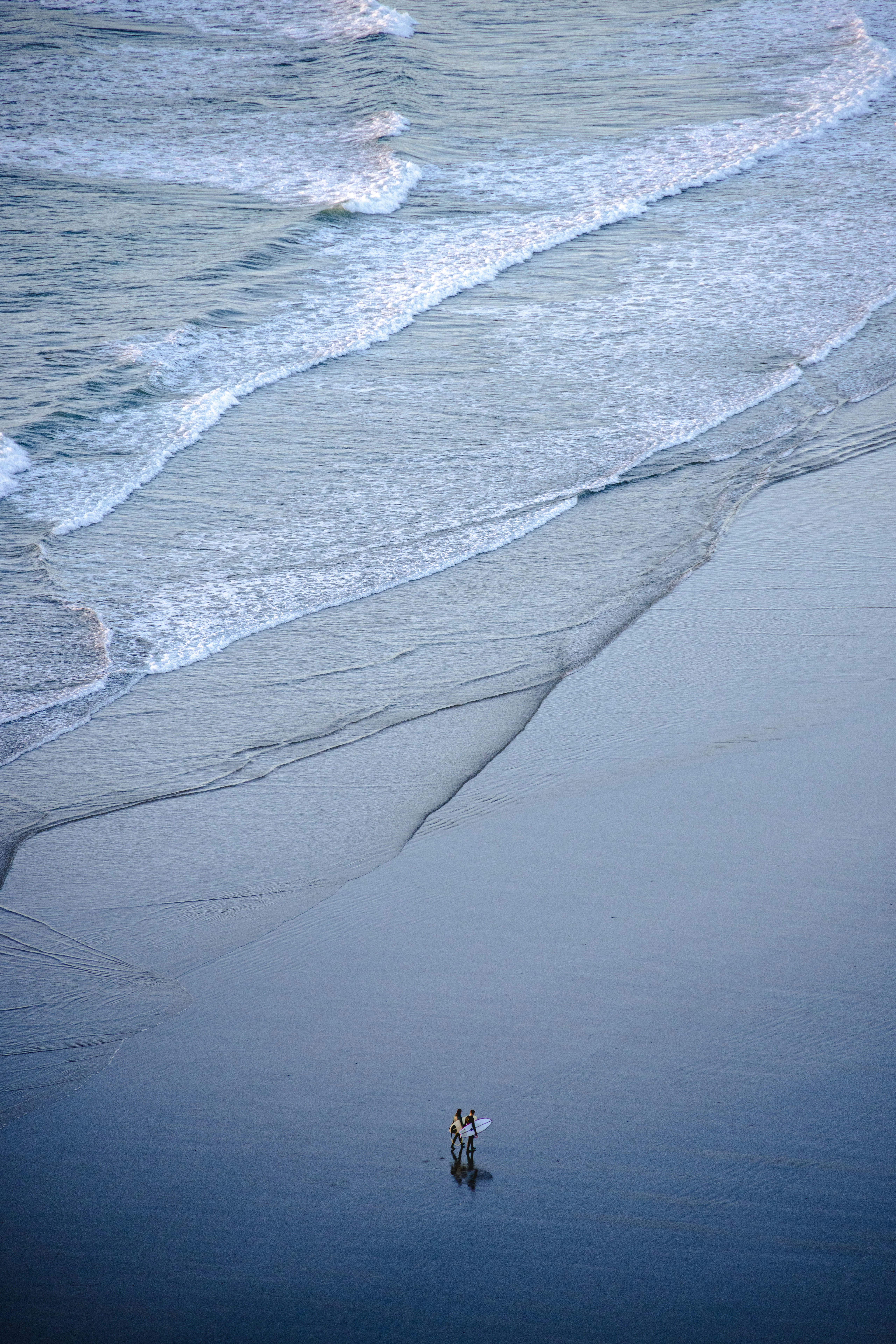 Distant Couple in a Tidal Ballet at the Edge of the World
