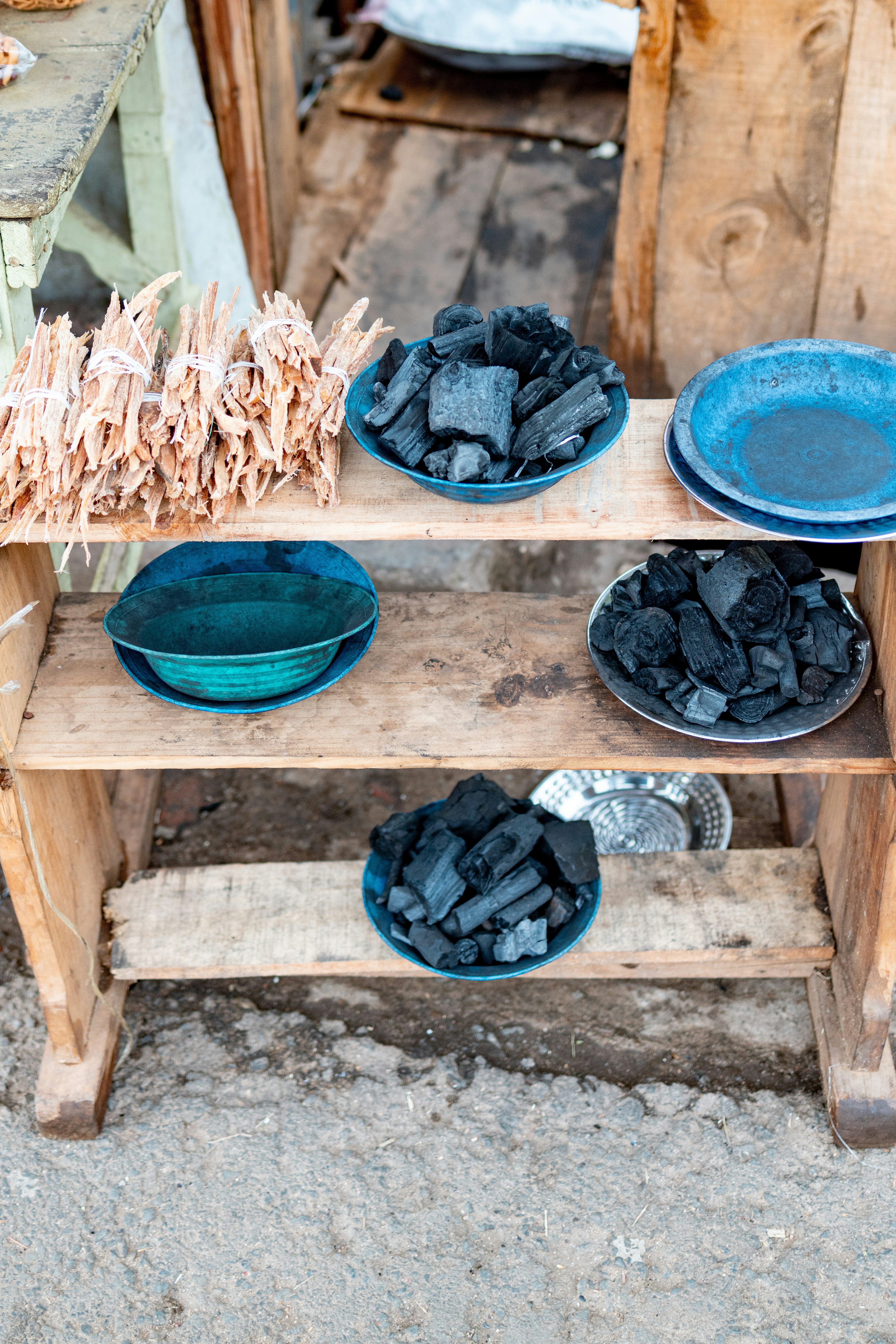 Charcoal and wood on rustic display shelves