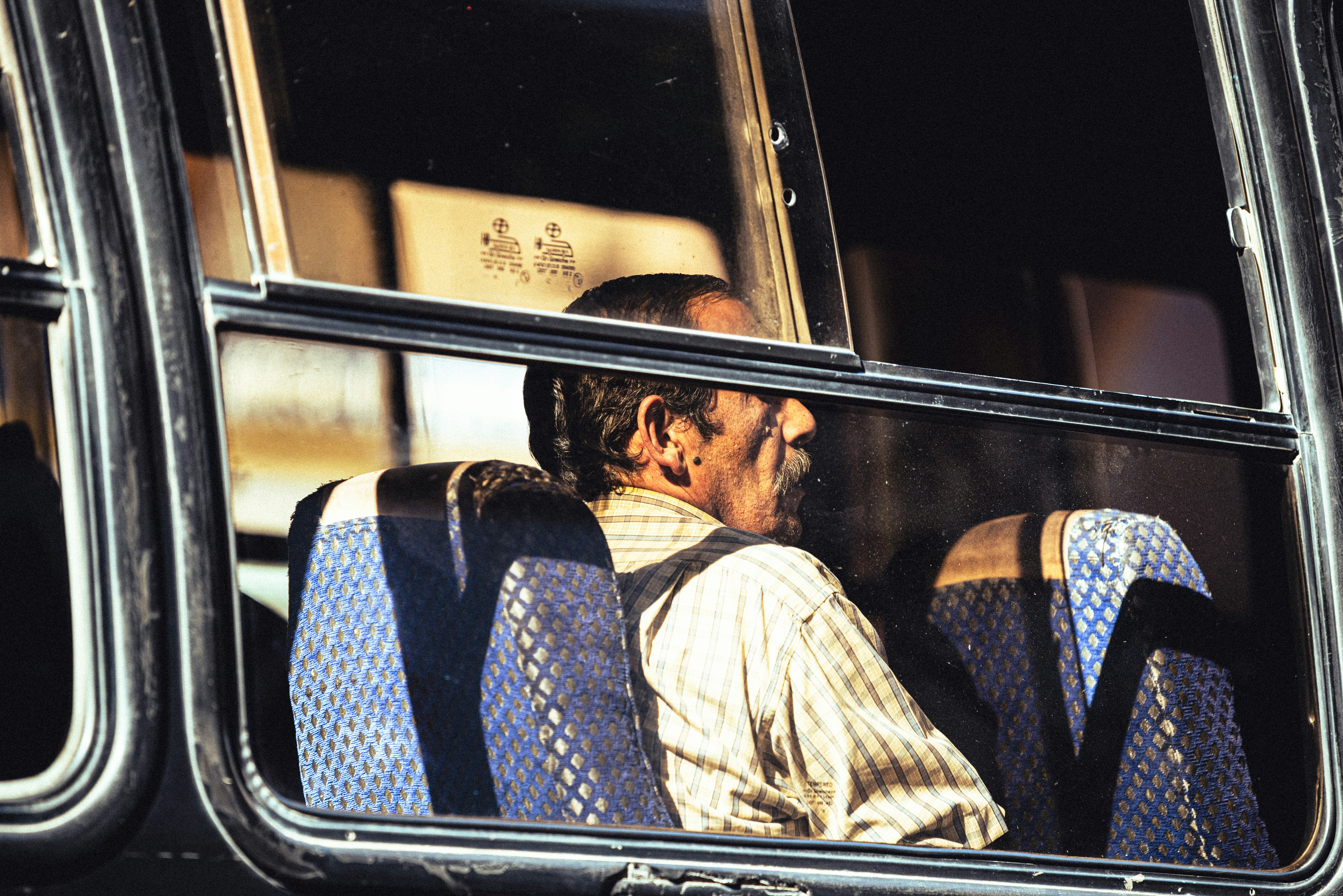 Window Seat Portrait: Silent Passenger in the Evening Bus