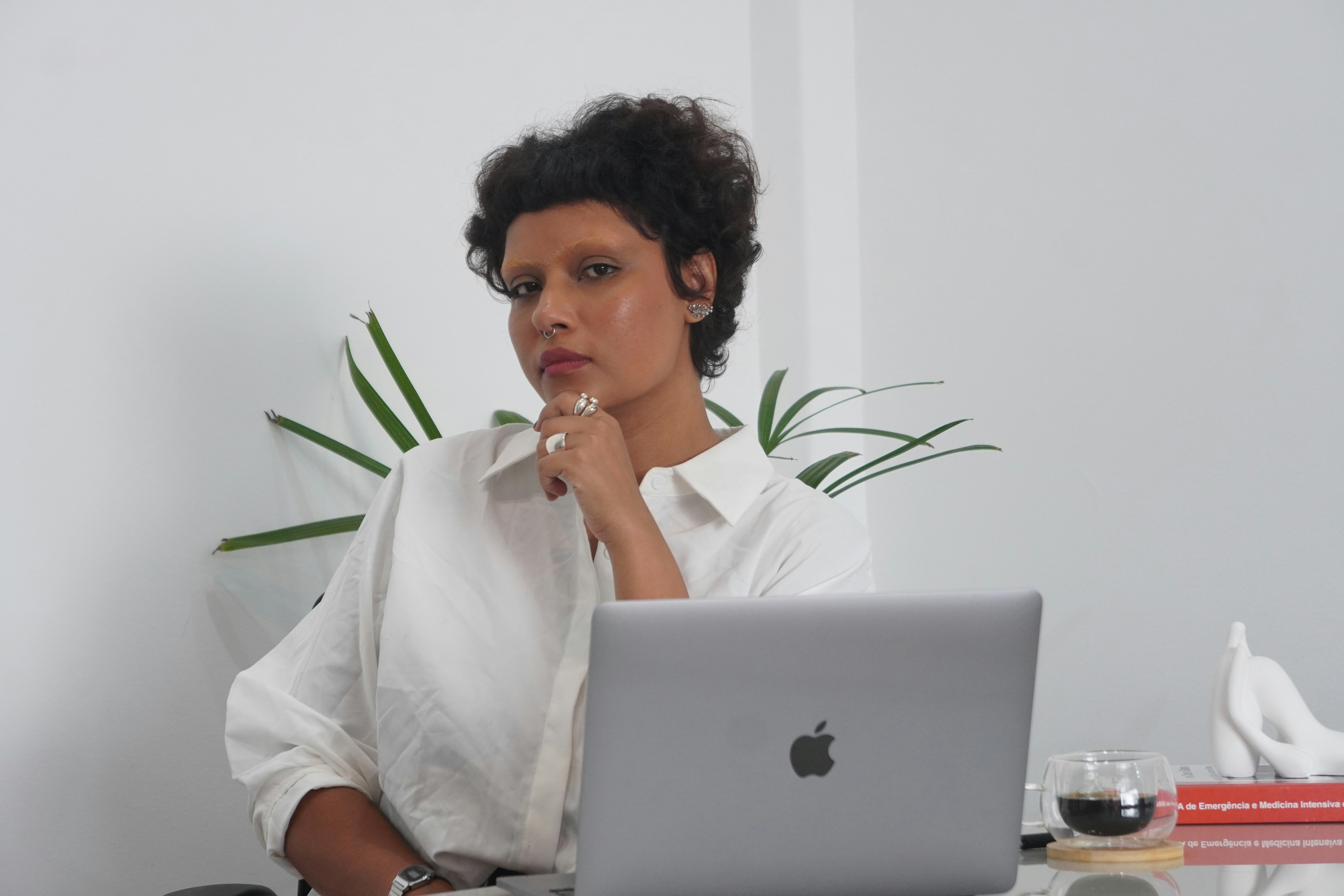 Desk Portrait: Confident Thinker at the Laptop