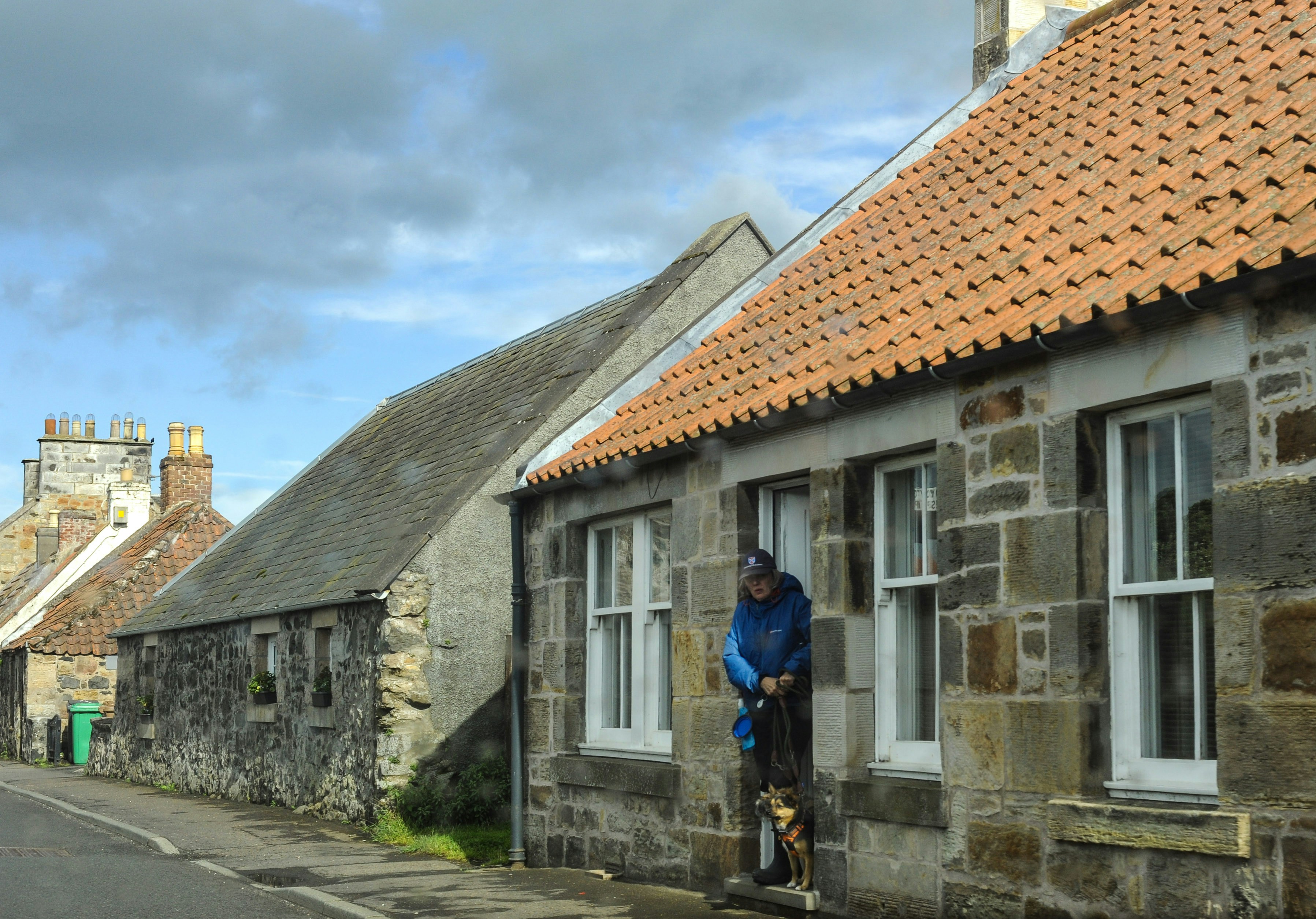 Blue-Clad Stranger at the Stone Cottage