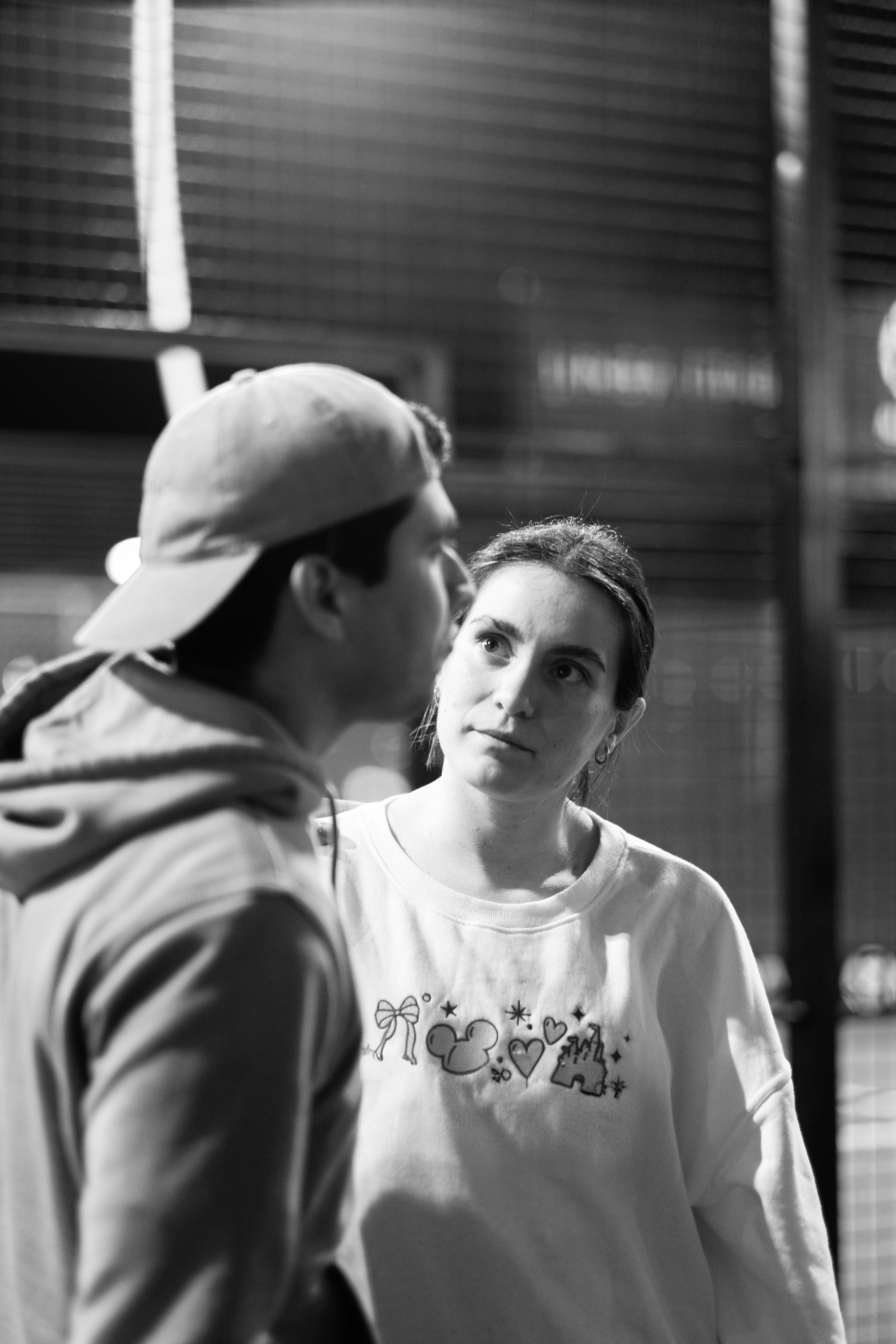 Quiet Exchange in a Night-Shift Studio