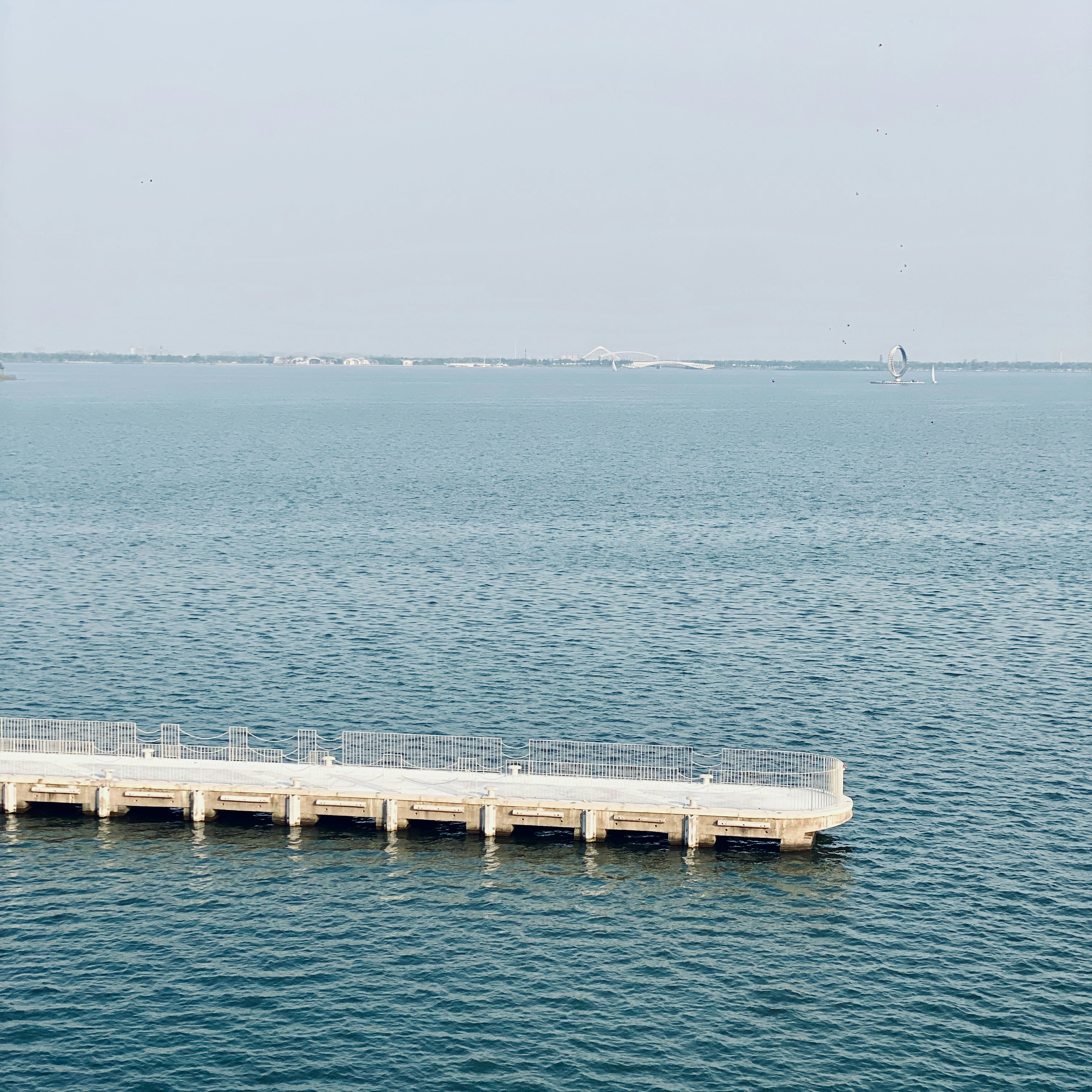 Calm Distant Waterfront with a Pier Edge