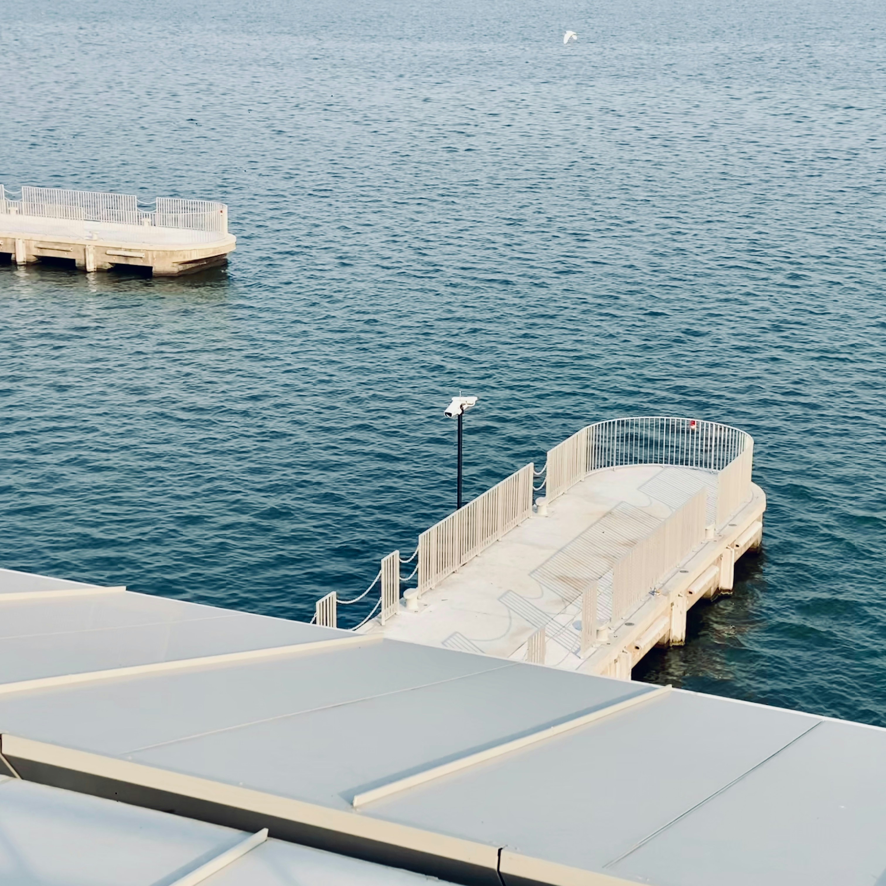 A Quiet Pier Reaches Toward an Expansive Sea