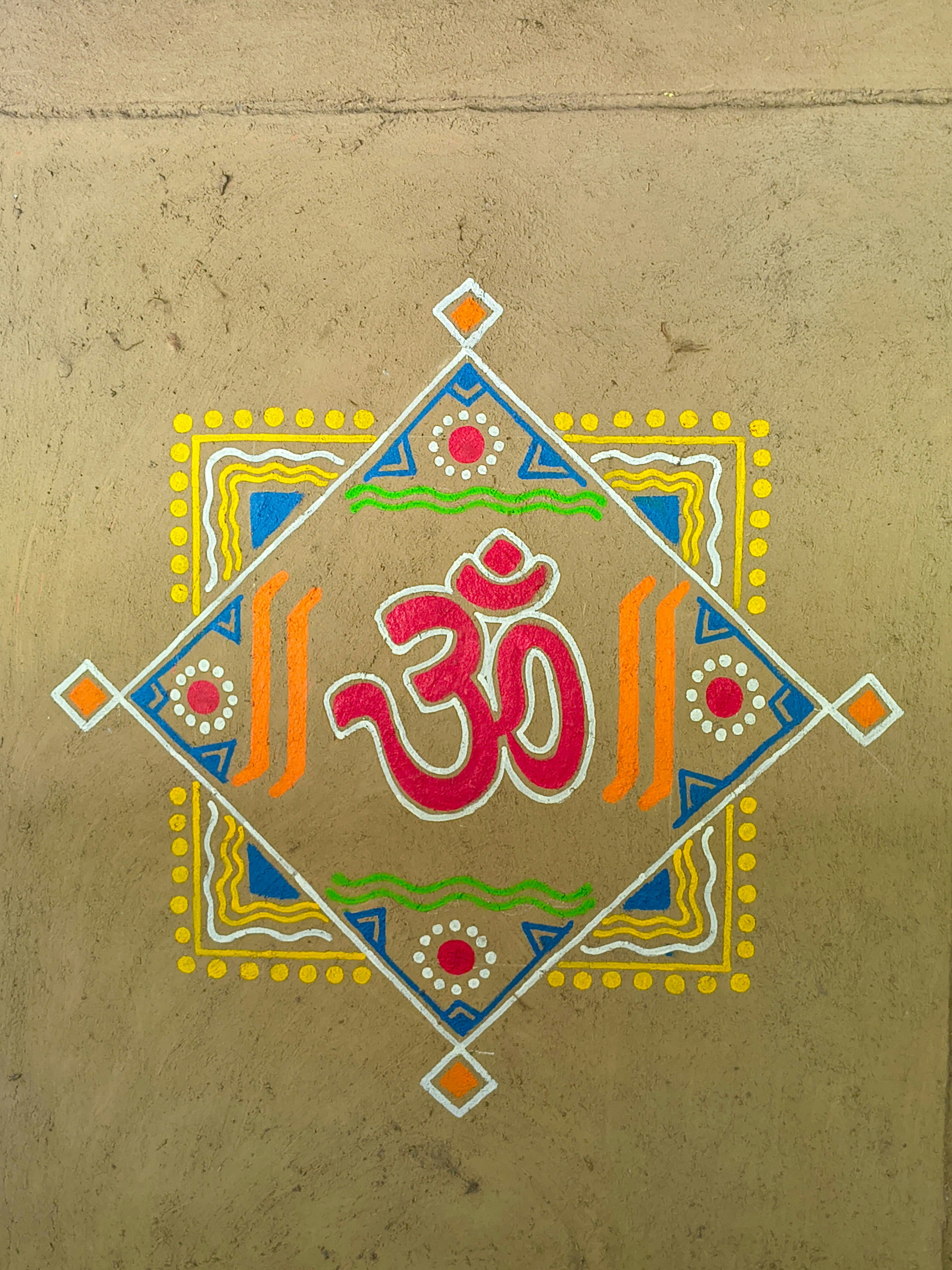 Central Rangoli Diamond: Om at the Heart