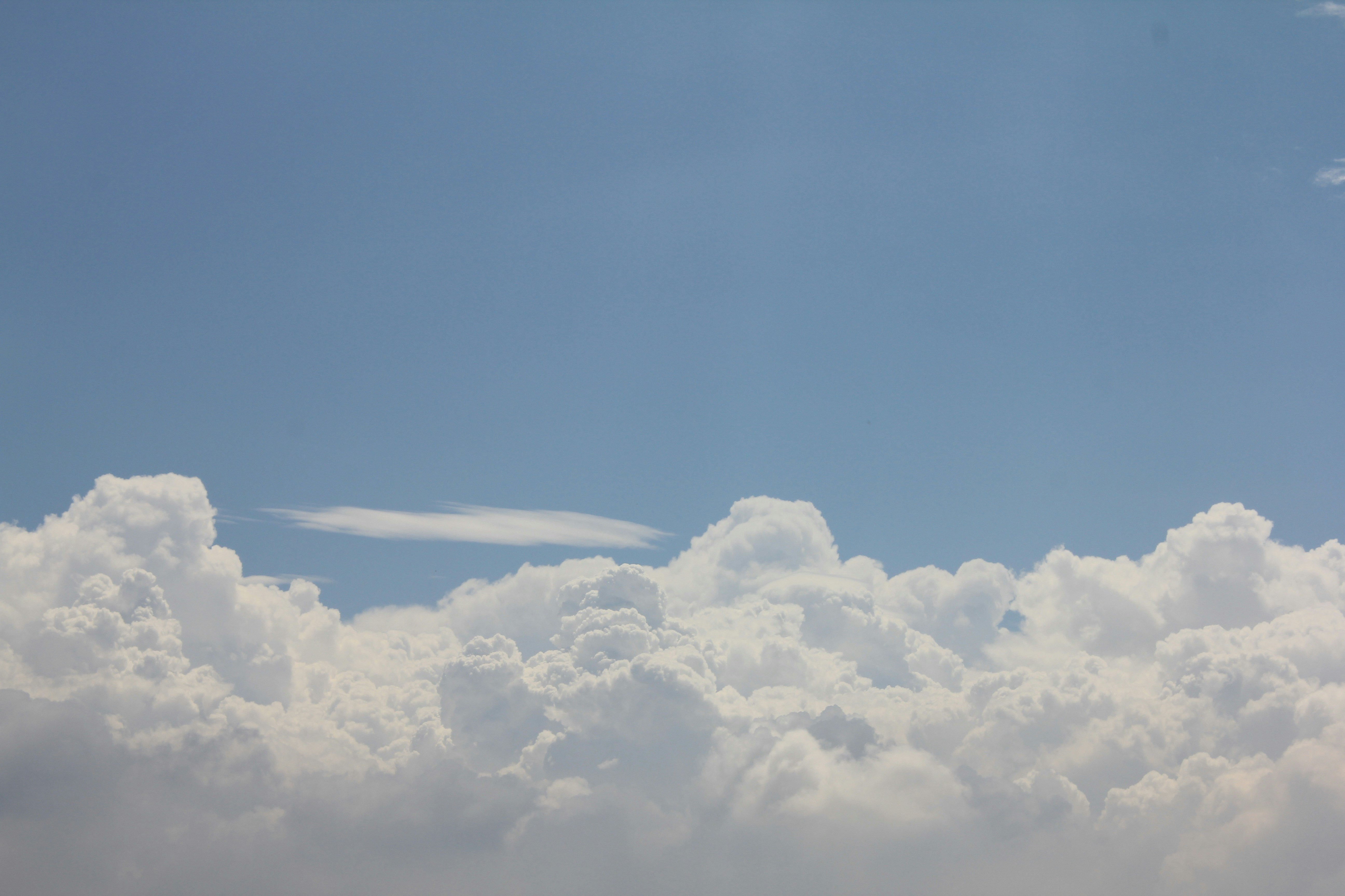 Above the Cloudline: A Clear Vista into Morning Sky