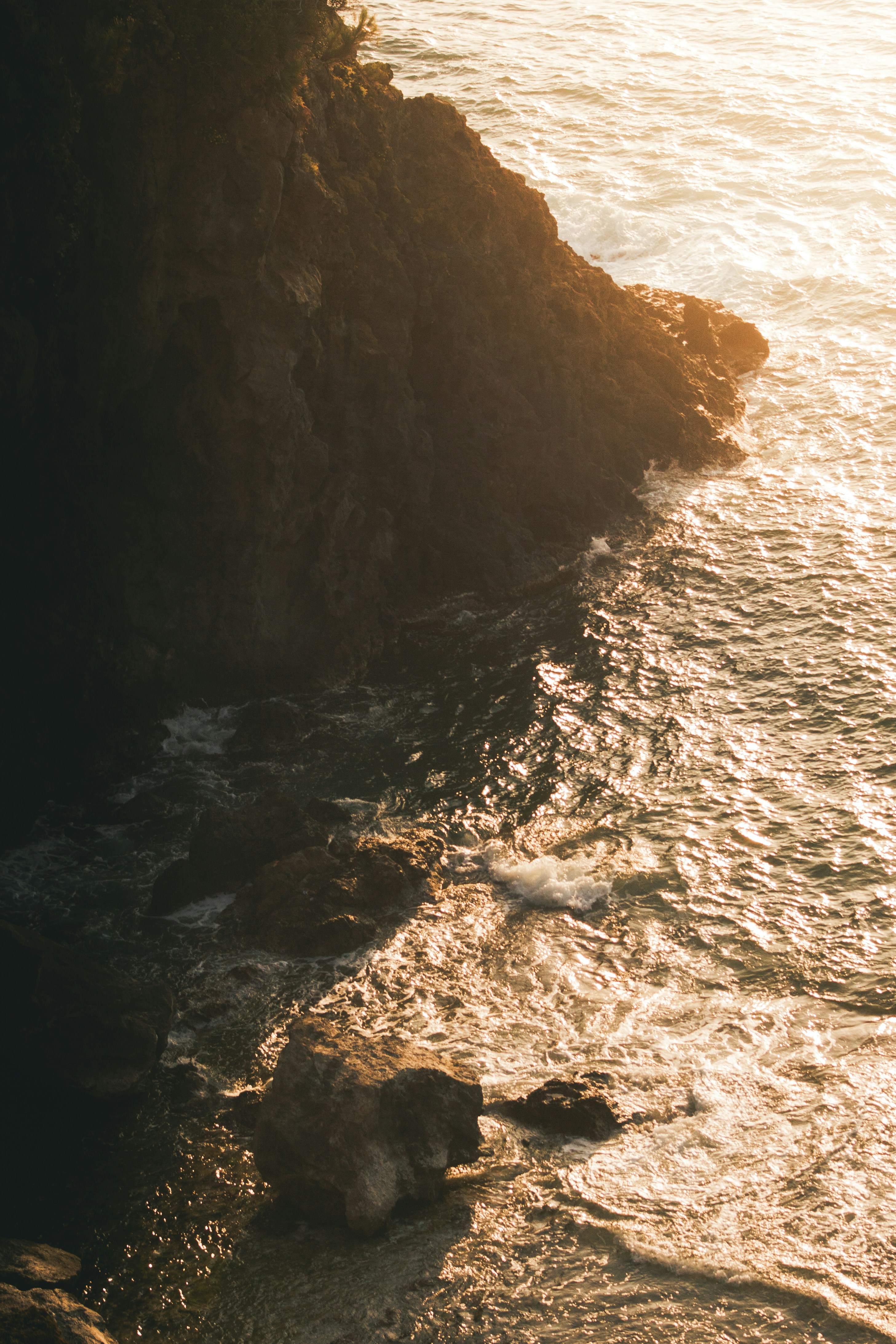 Golden Cliffs Meet the Sea at Dusk